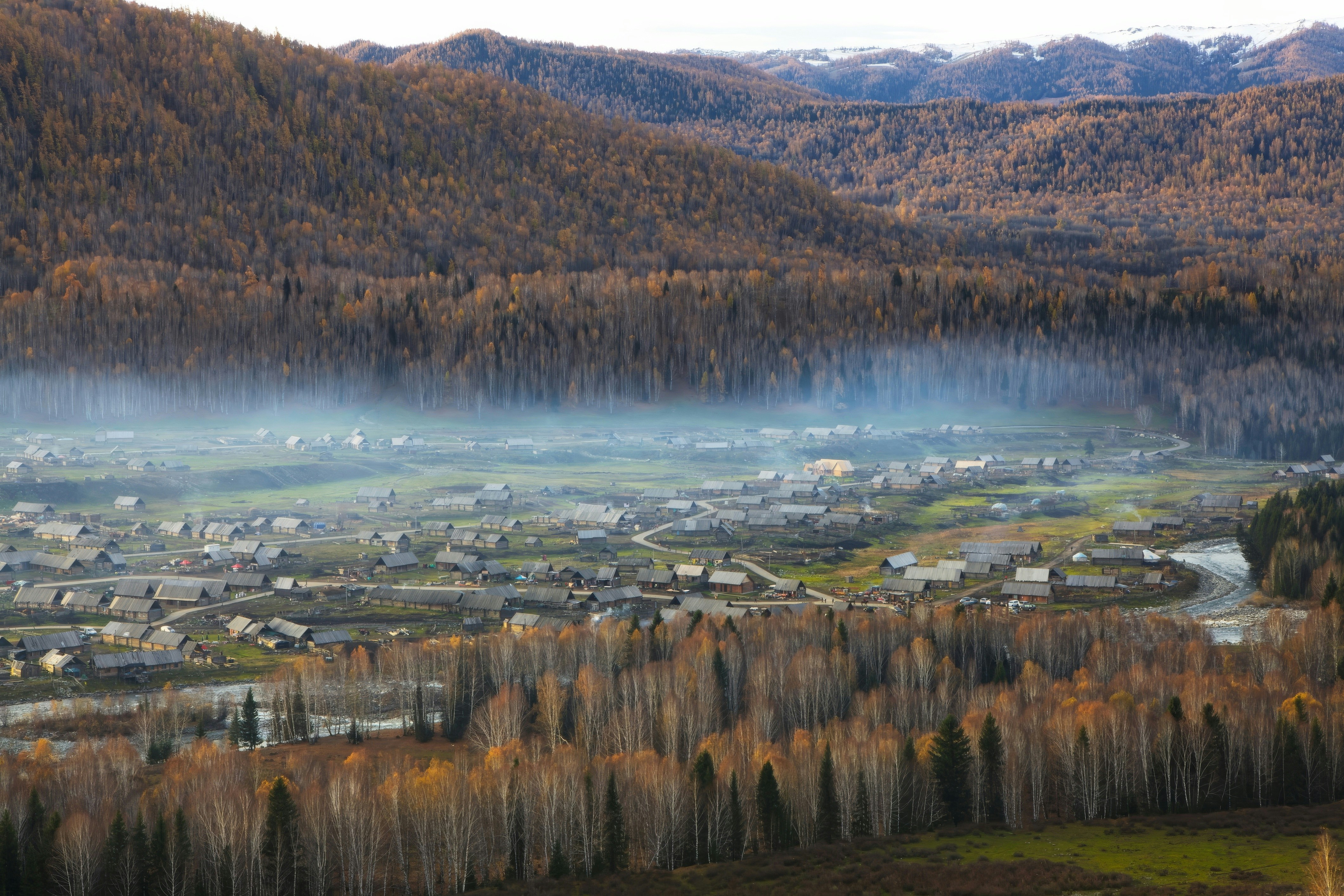 Autumn Mist Drapes a Mountain Valley Village