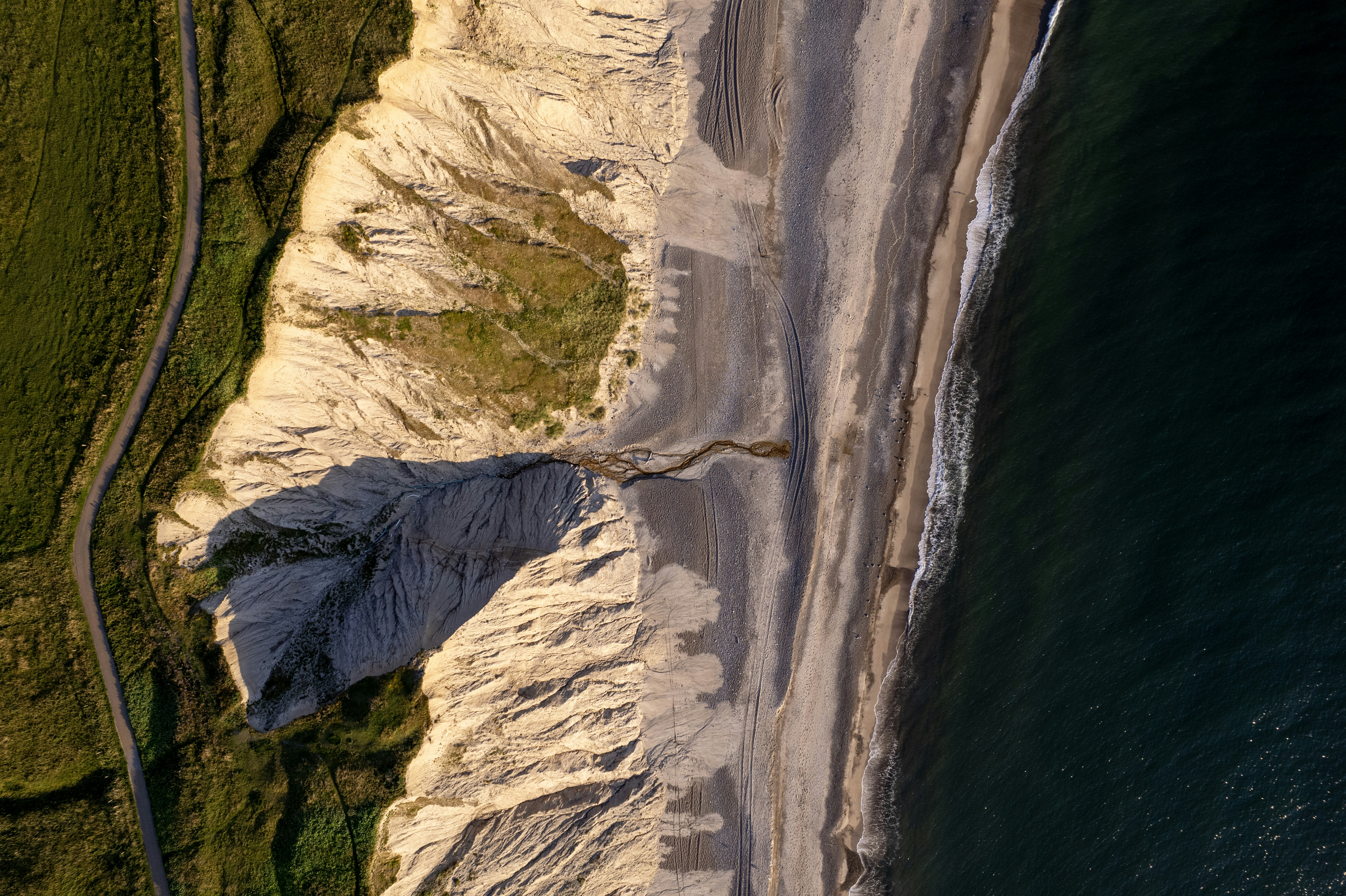 Chalk Coastline from Above: White Cliffs, Green Slopes, and a Winding Headland