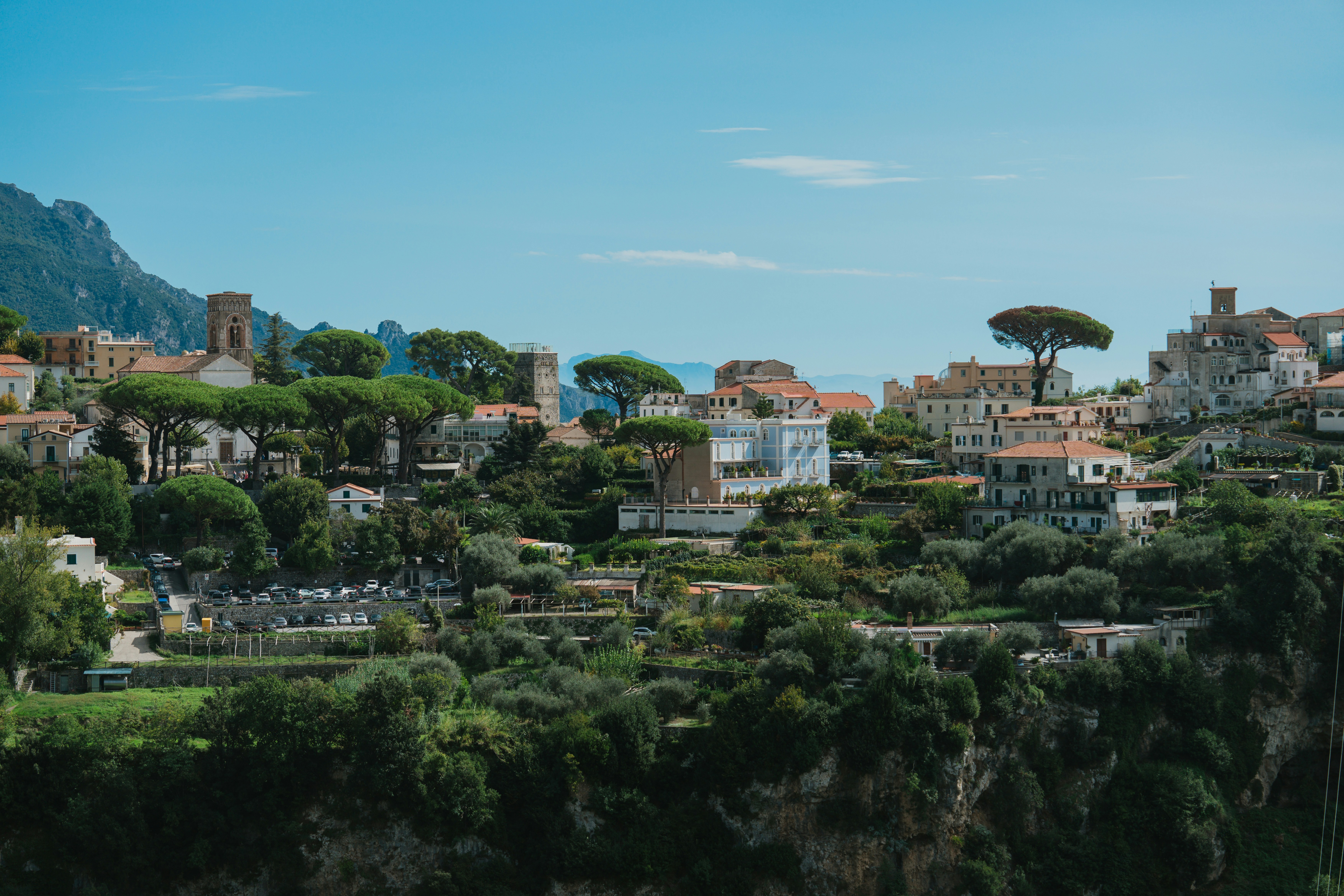 Coastal Italian hillside village under a clear blue sky