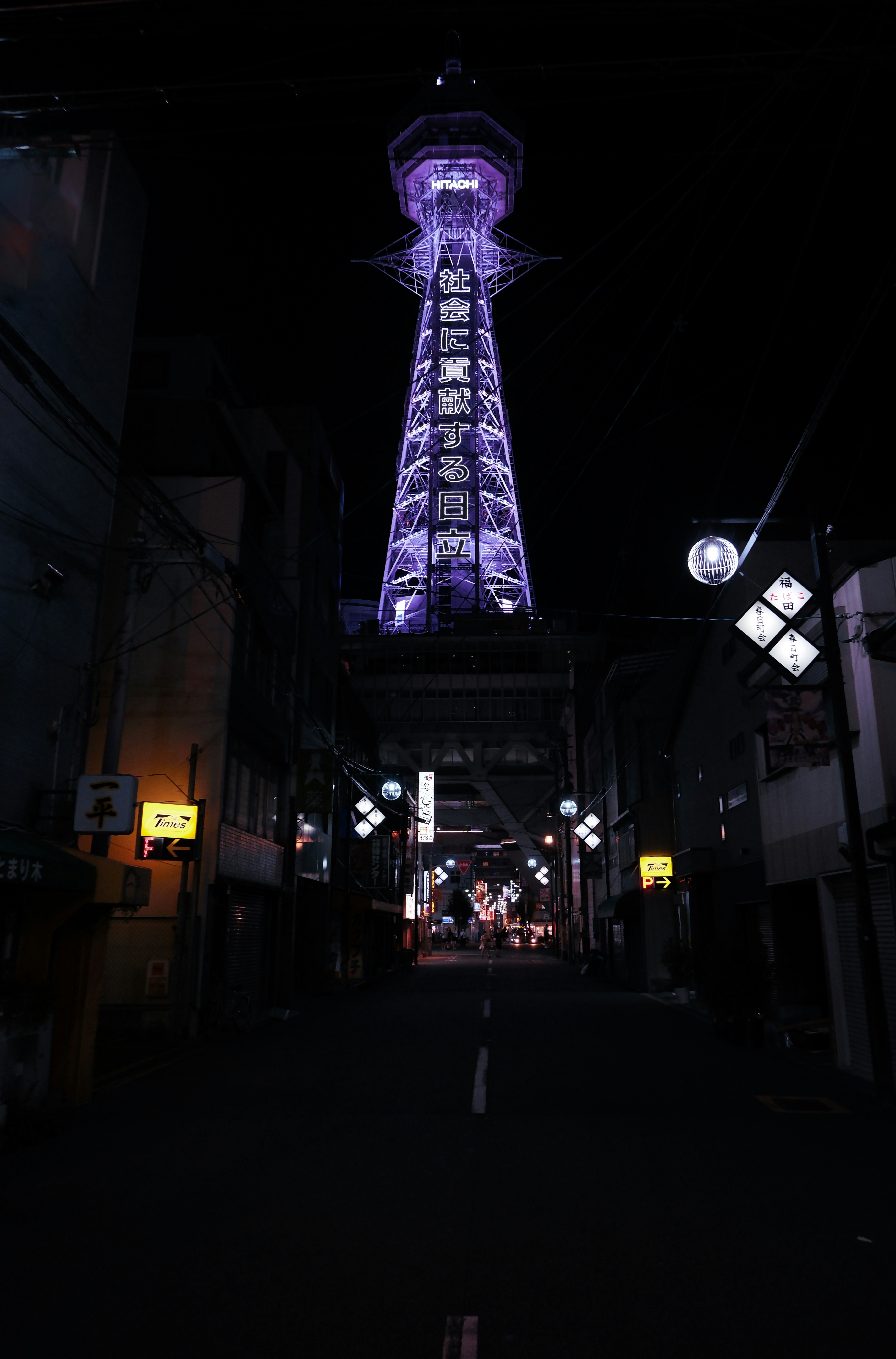 Neon Spire Over Quiet Alley