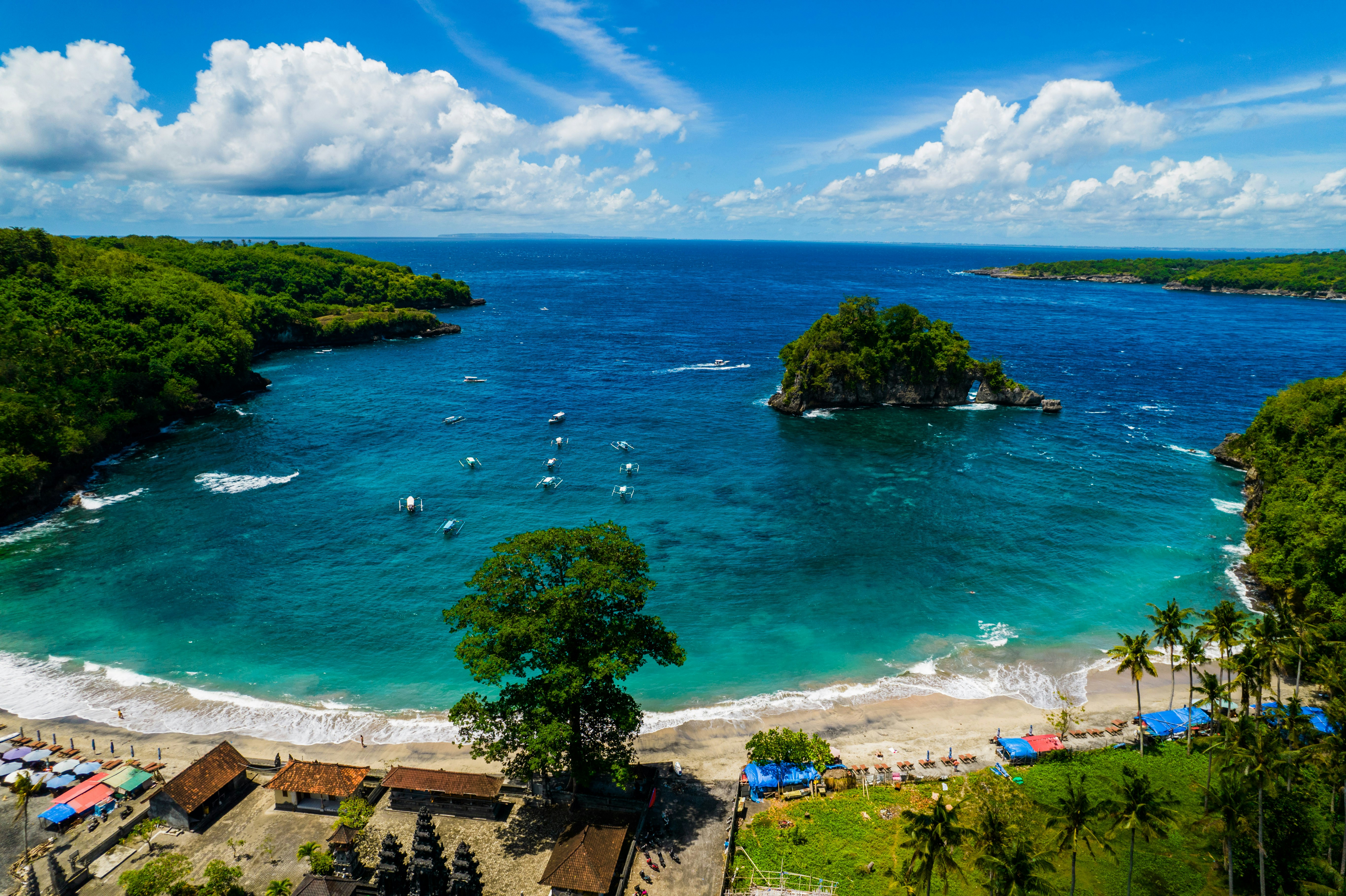 An aerial view of a beach with boats in the water photo – Free Tropical ...
