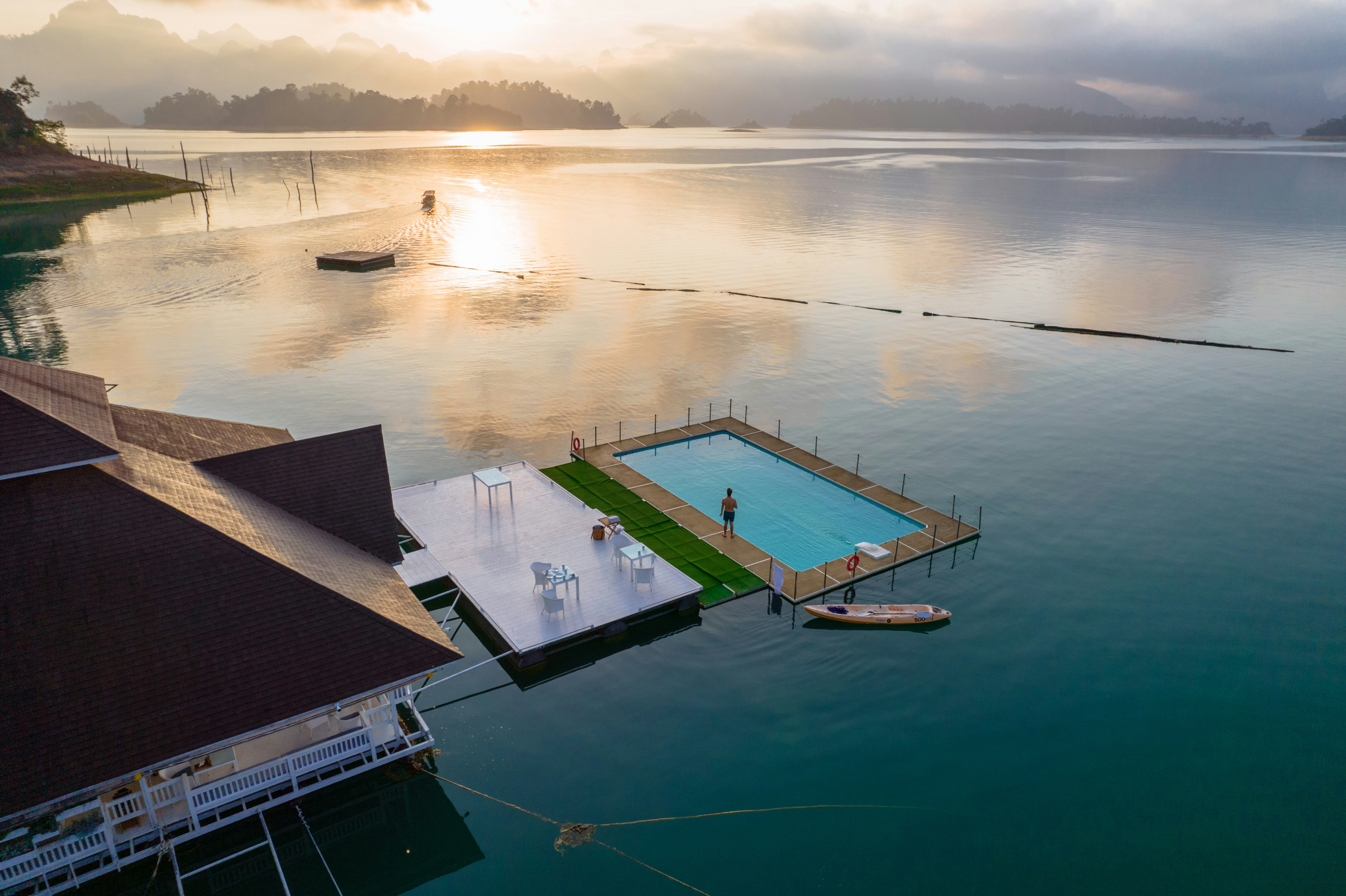 A body of water with a dock in the middle of it