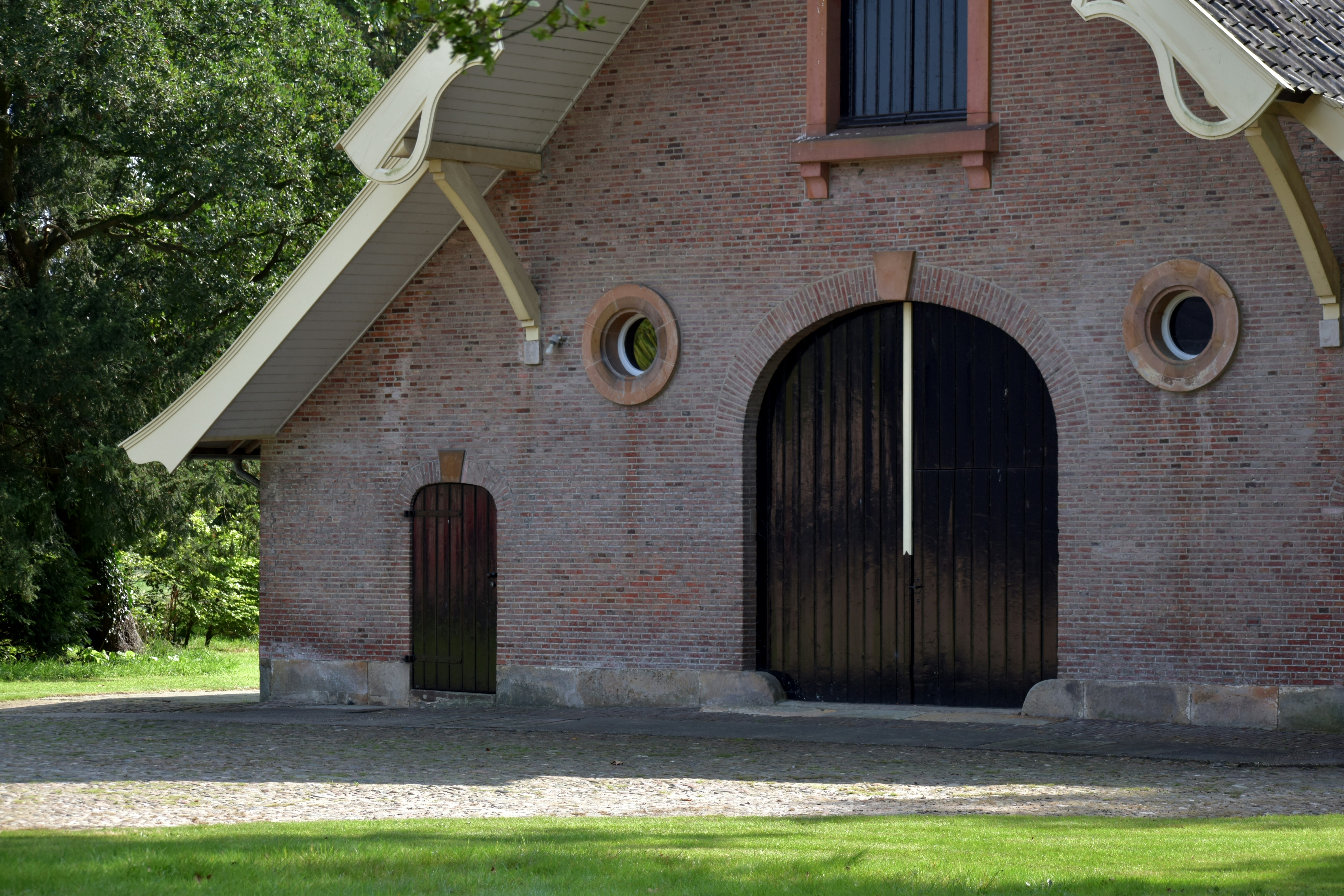The Quiet Arch: Symmetry and Shadow on a Brick Facade