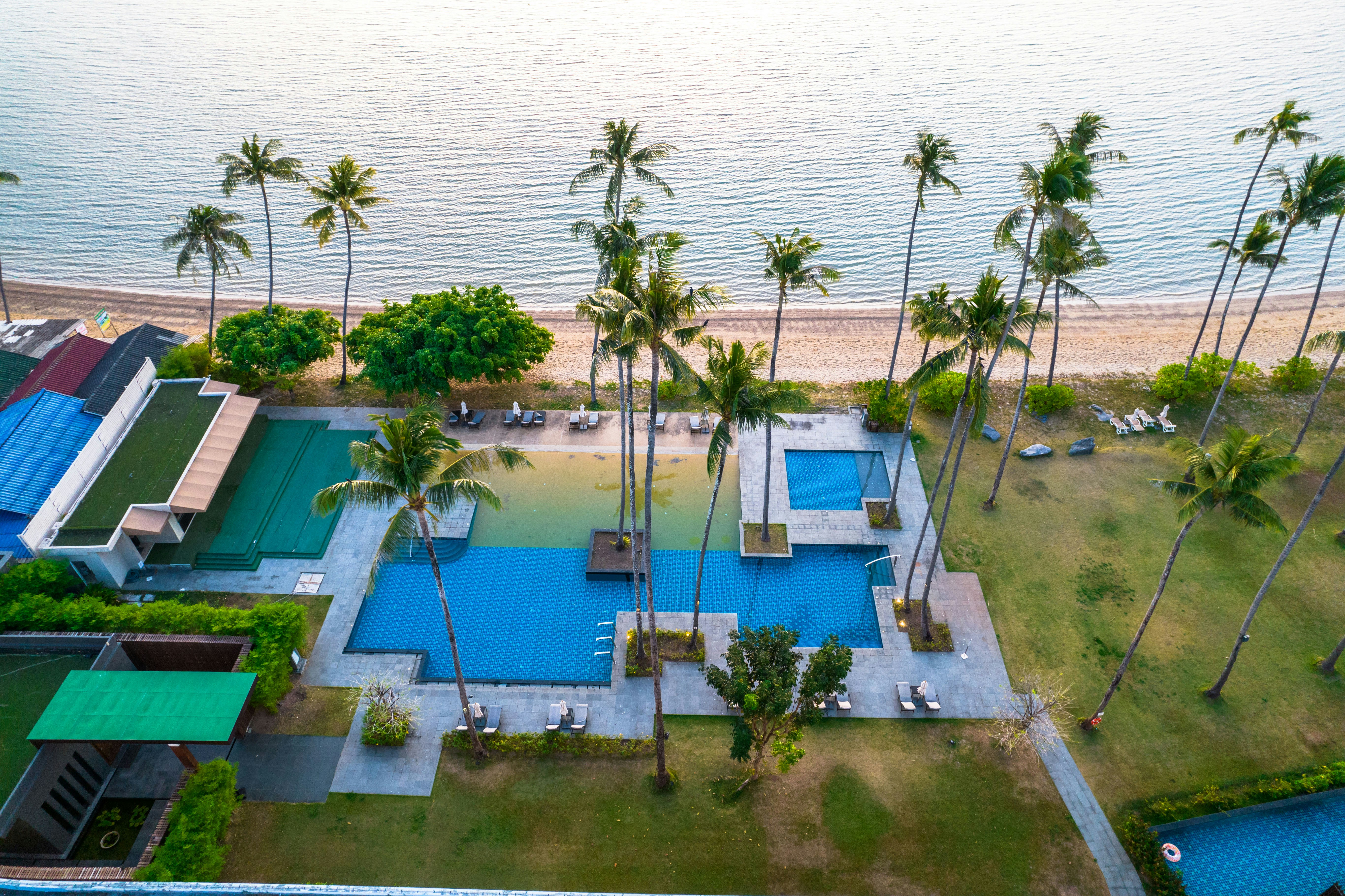 An aerial view of a resort with a swimming pool photo – Free Sea Image ...