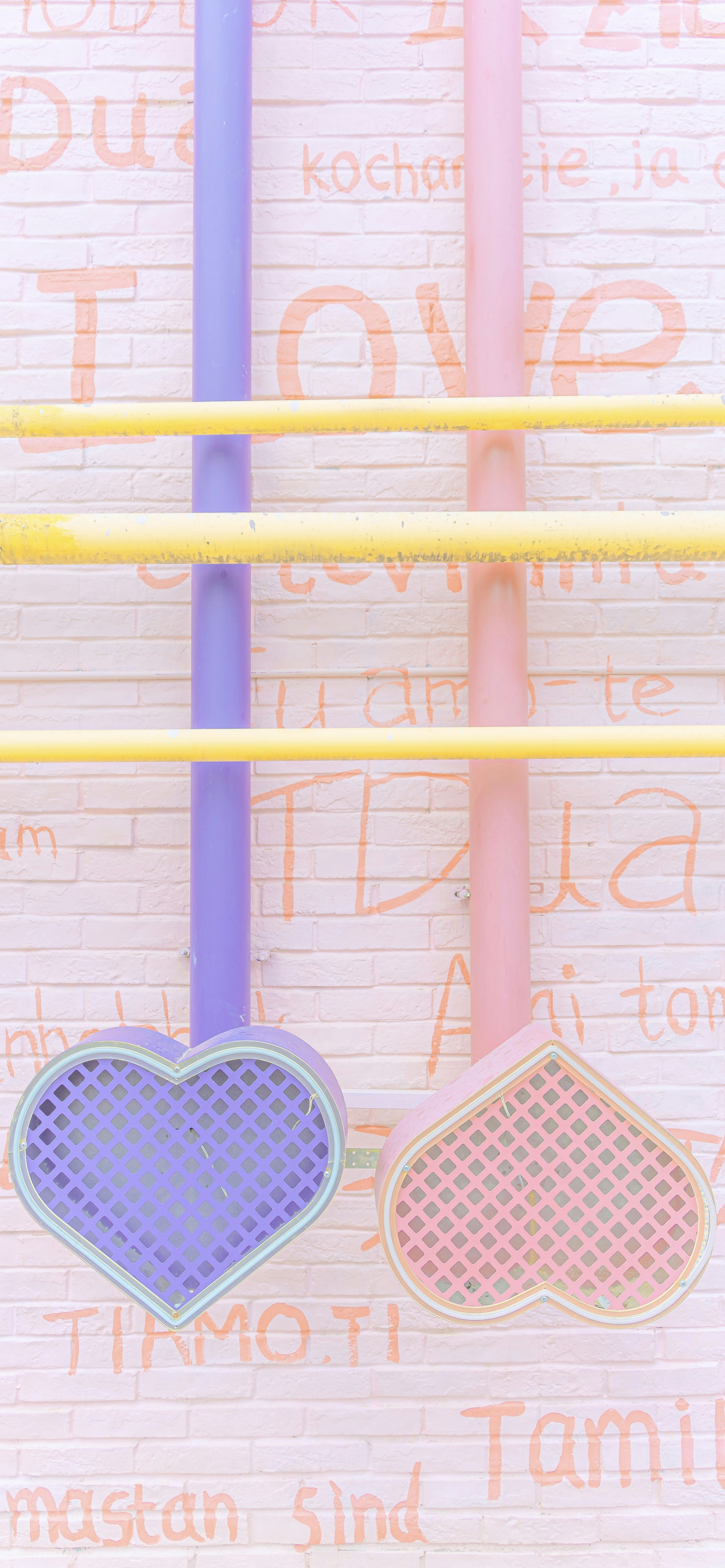 Pastel Playgrounds: Pebbled Hearts on a Neon Wall