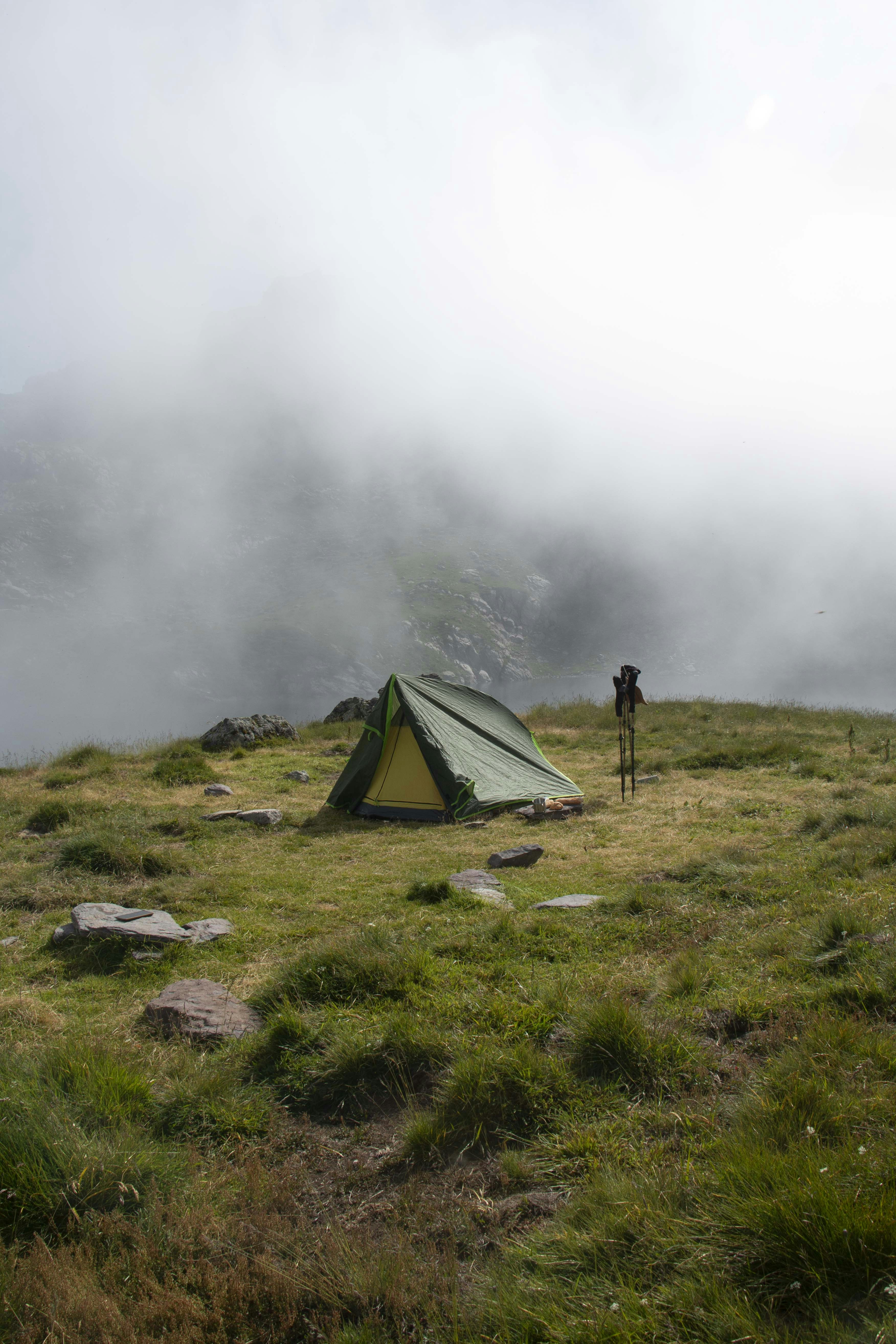 Green Tent on a Mist-Wrapped Ridge
