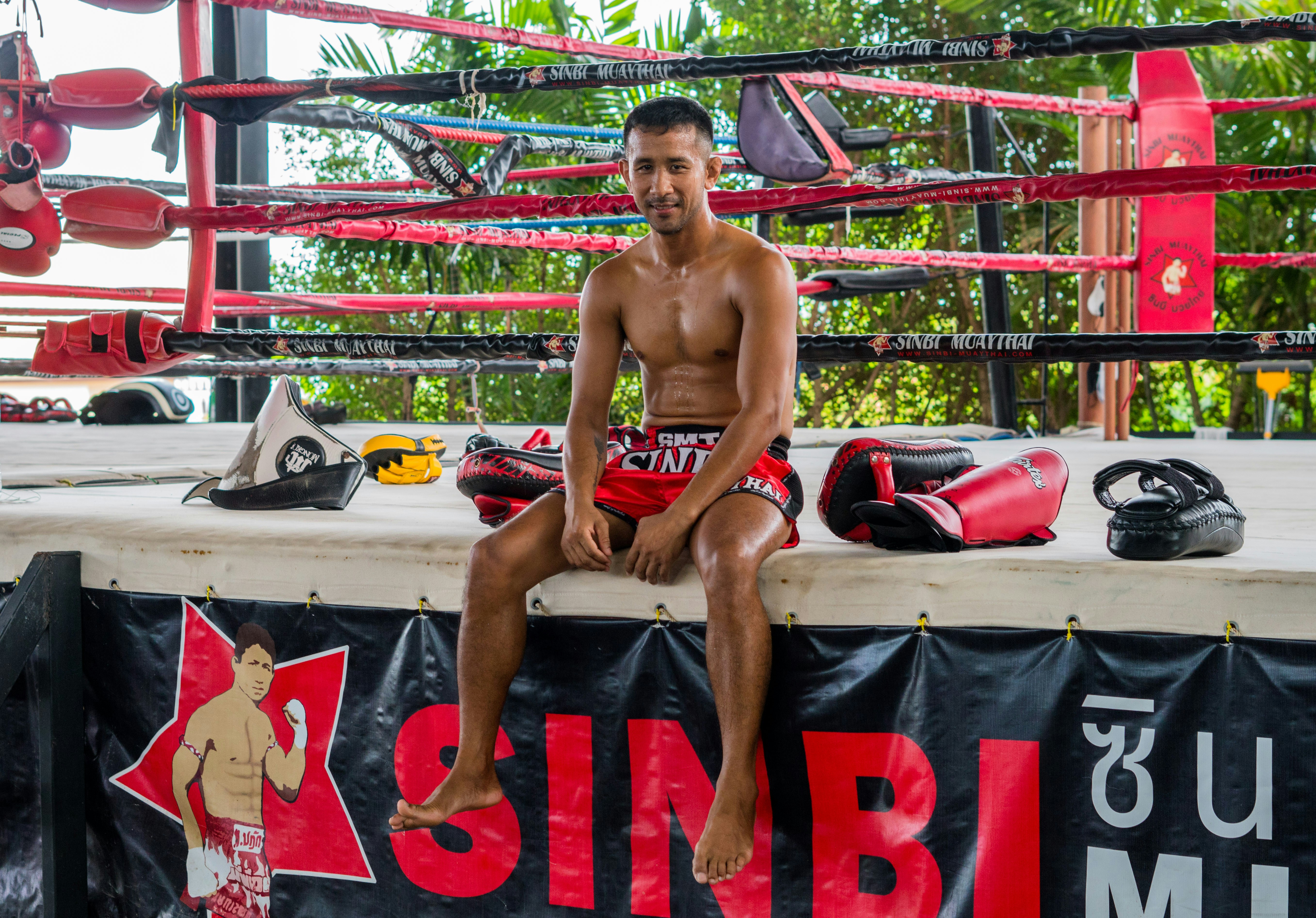 A man sitting on a bench in a boxing ring photo – Free Phuket Image on ...