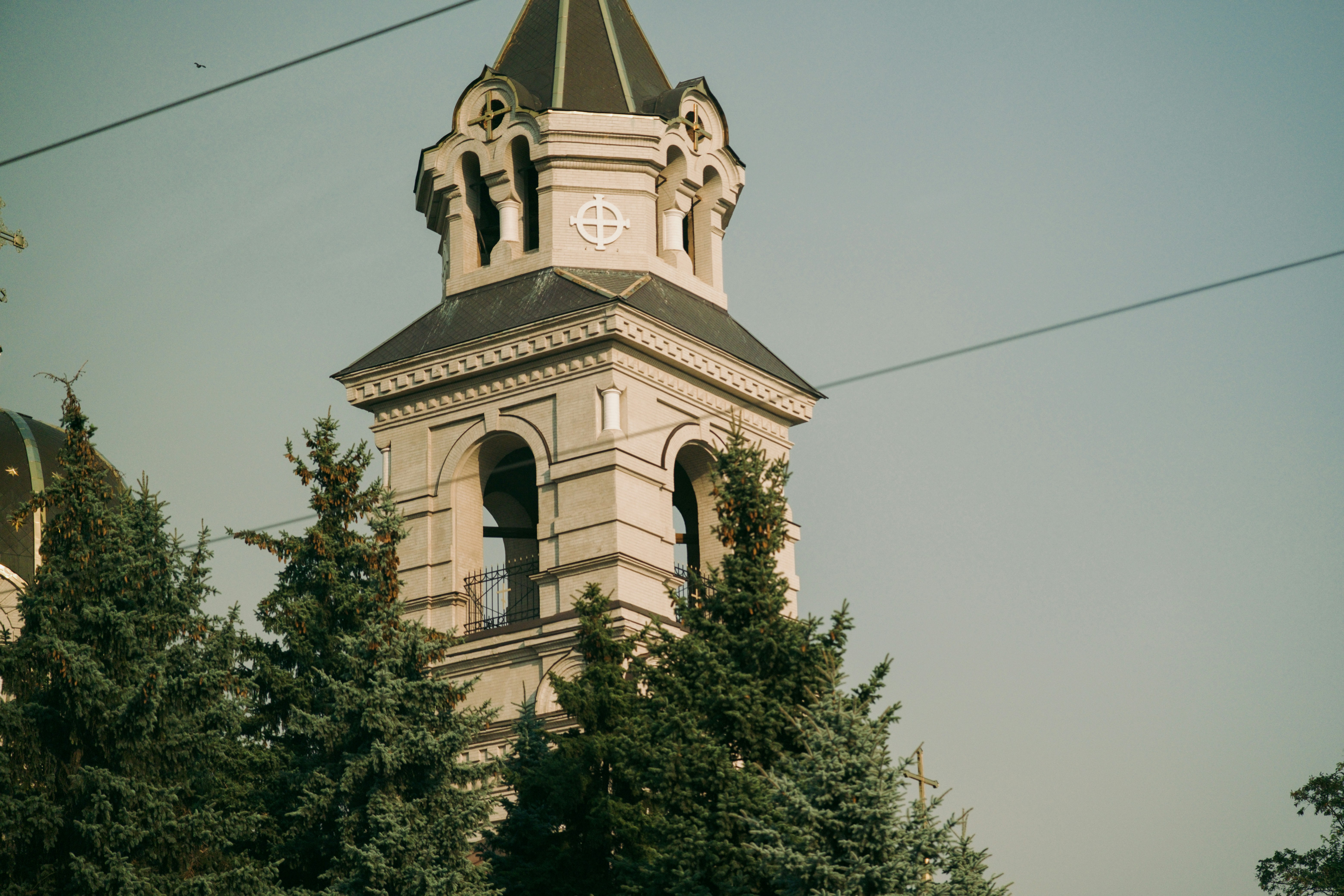 A tall clock tower with a clock on each of it's sides photo – Free ...