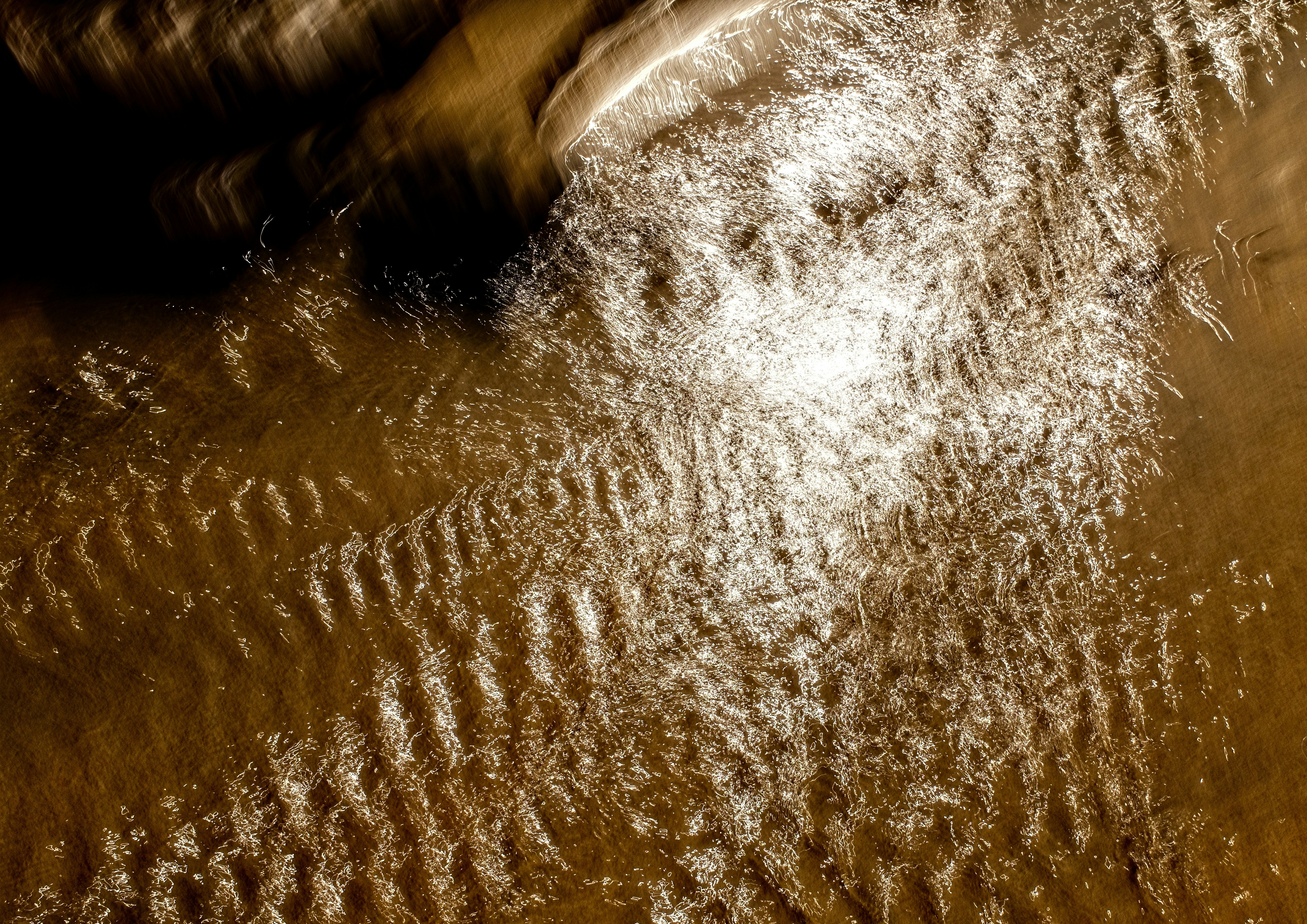 Foam Trails Across a Russet River