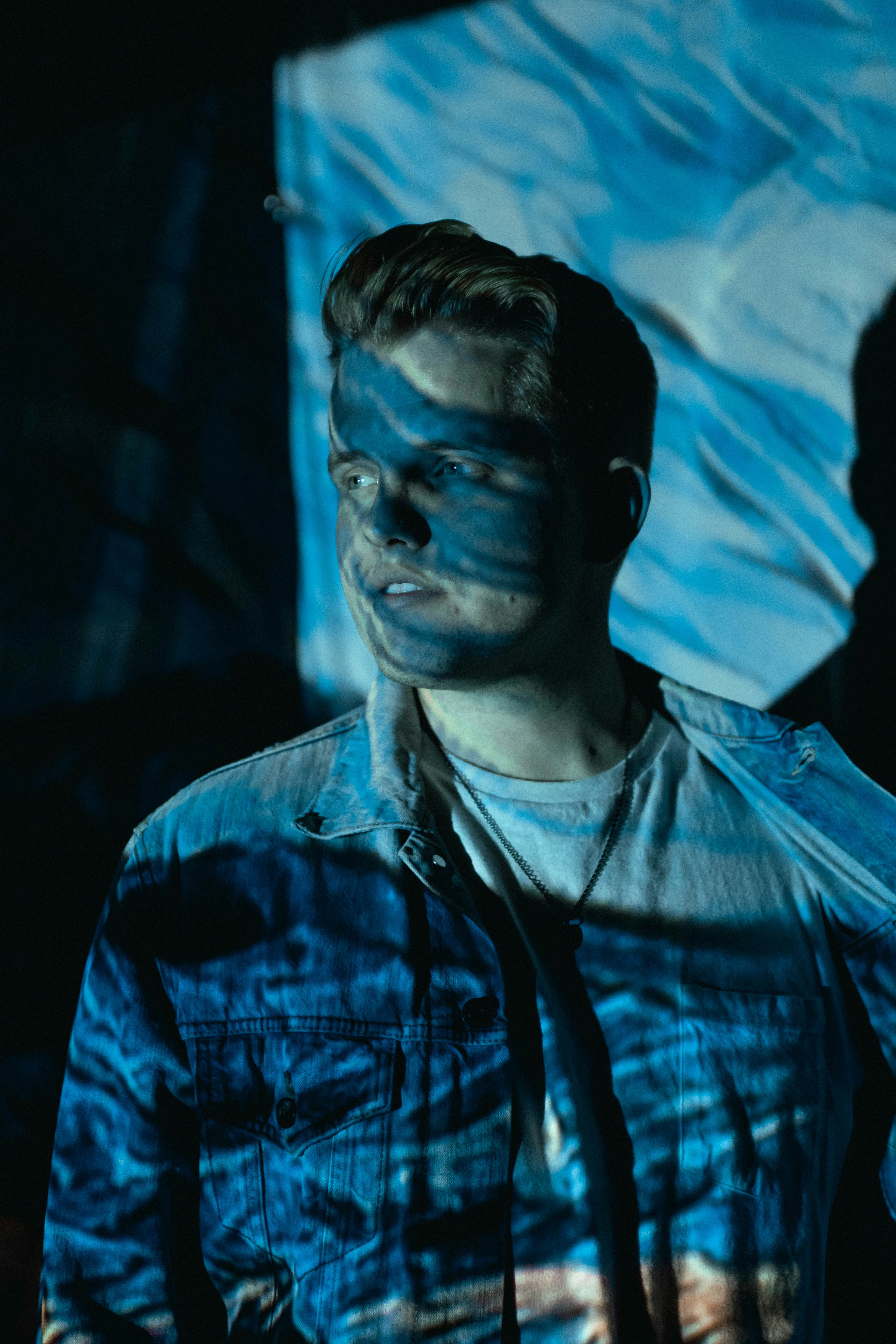 Blue-lit Strands: A Fashioned Moment Under Shadowplay
