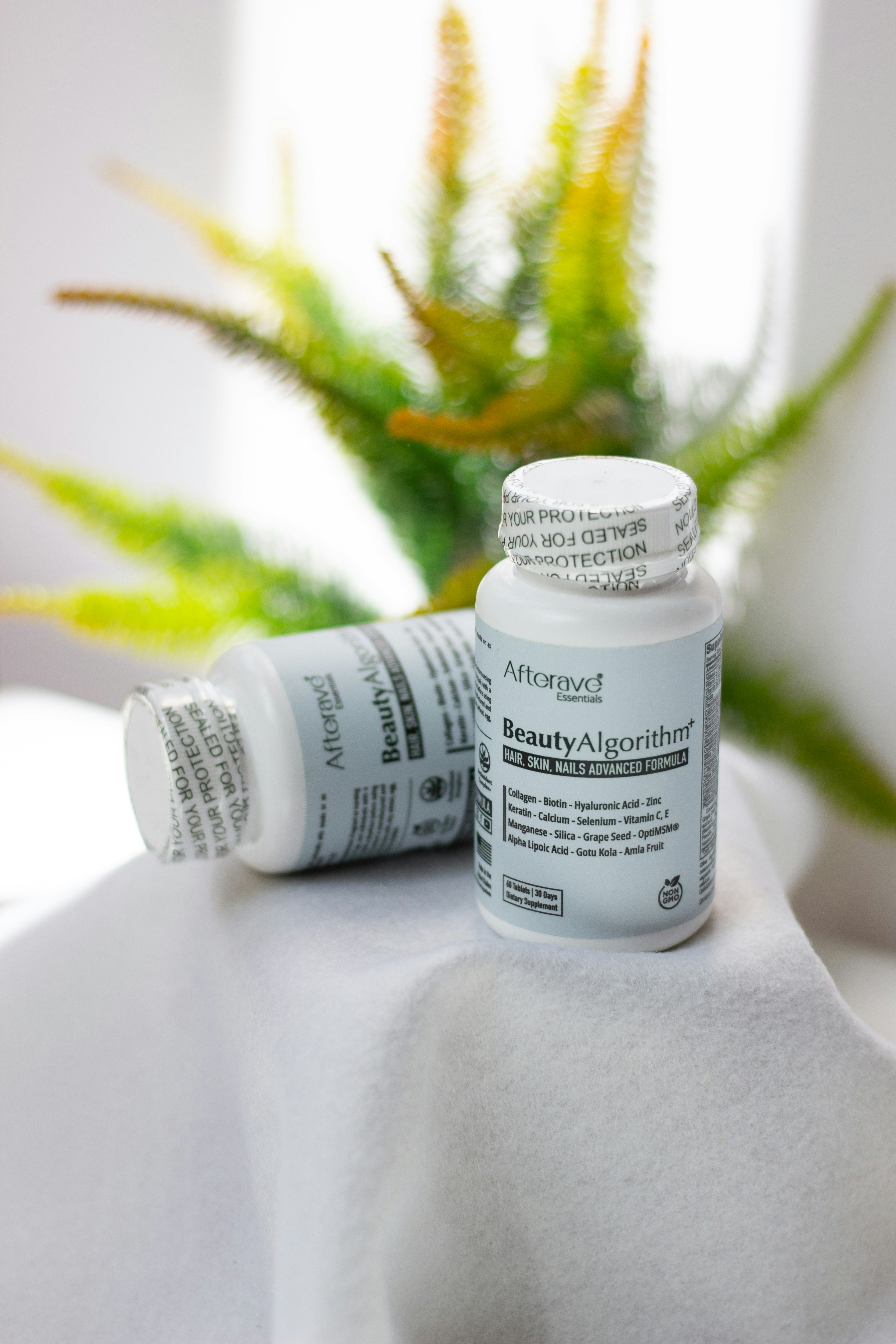 A close up of two bottles of medicine on a table photo – Free Skin firmness Image on Unsplash