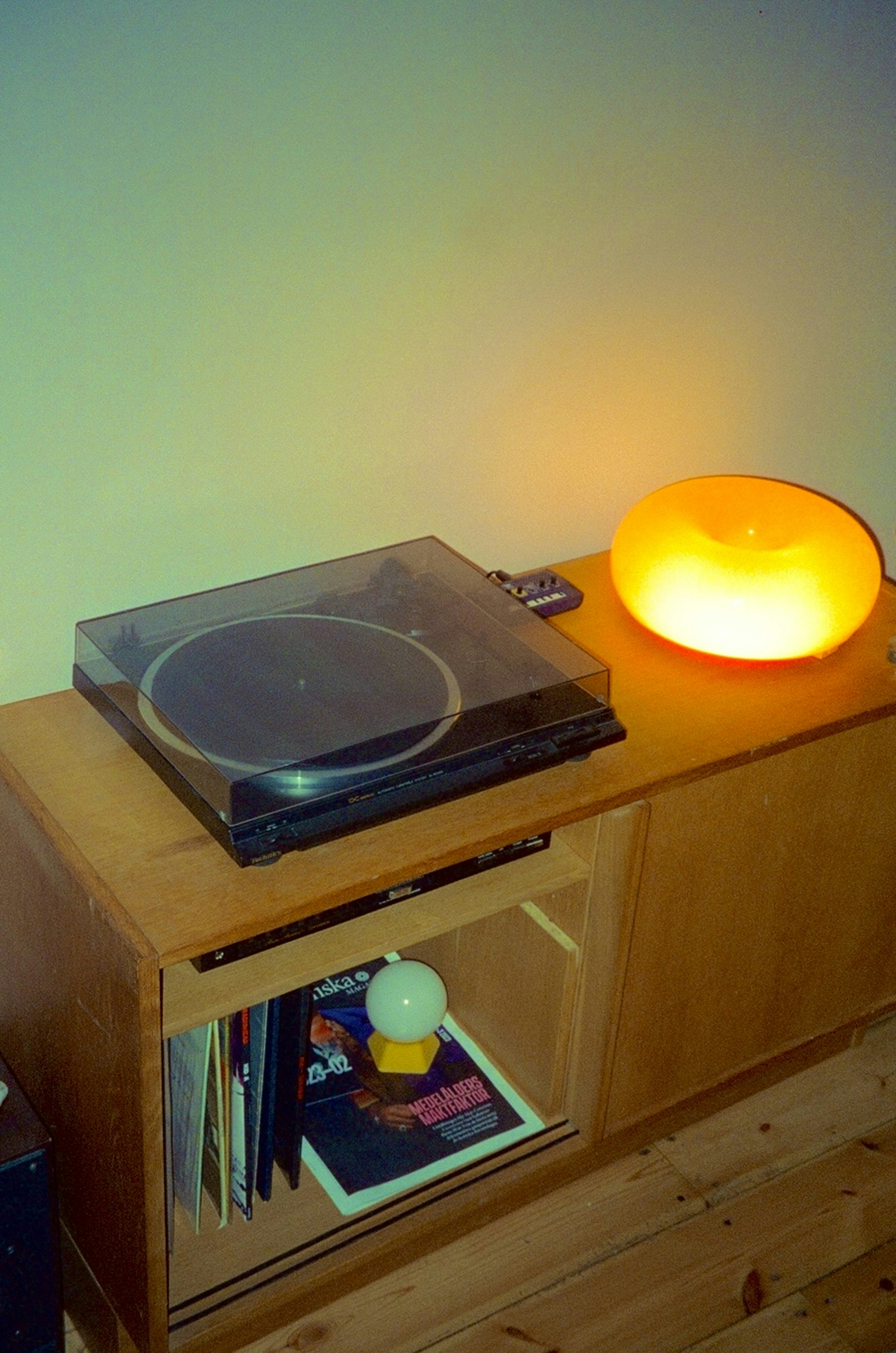 A turntable sitting on top of a wooden cabinet photo – Free ...