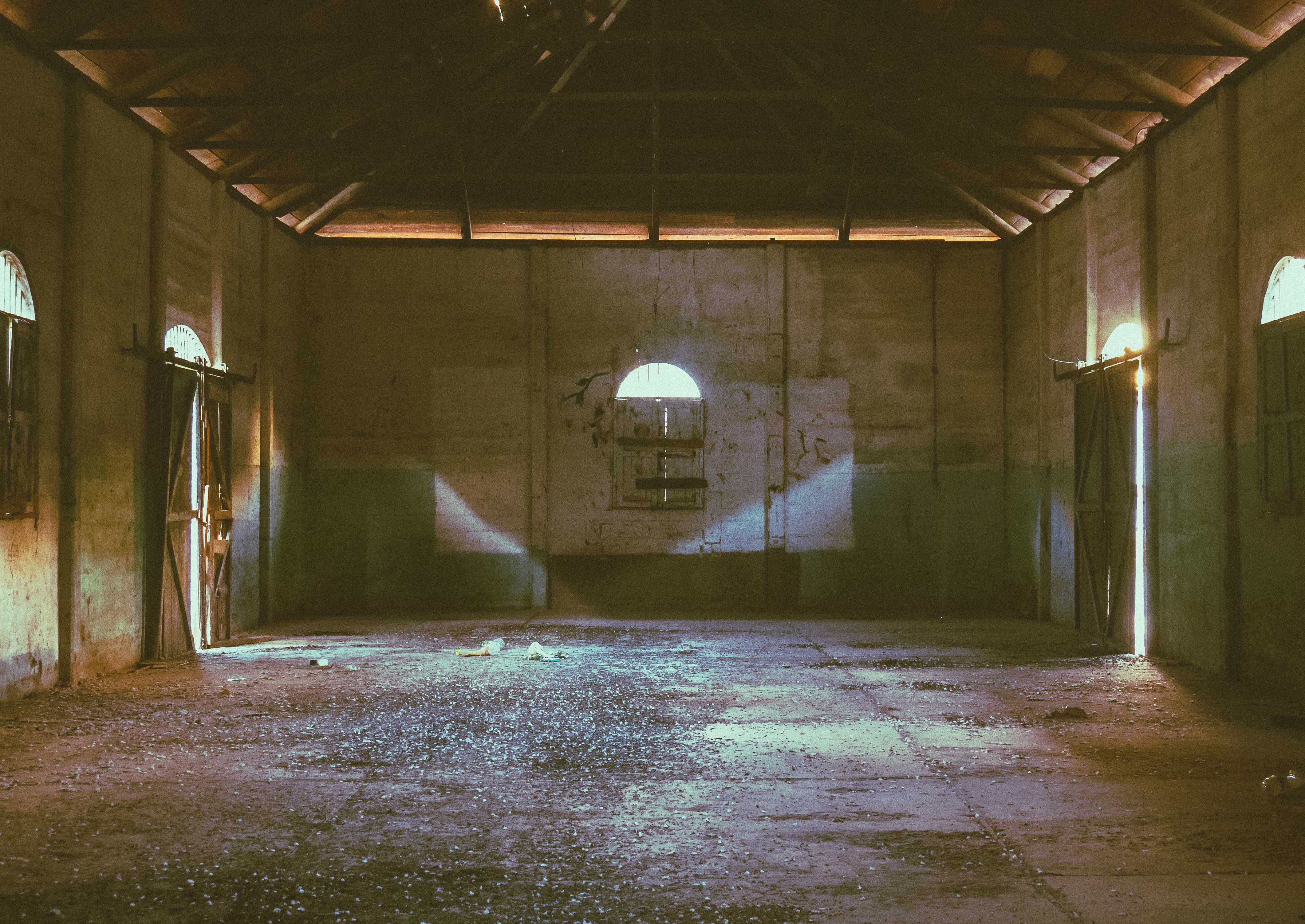 A dimly lit room with two doors open photo – Free Travel Image on Unsplash