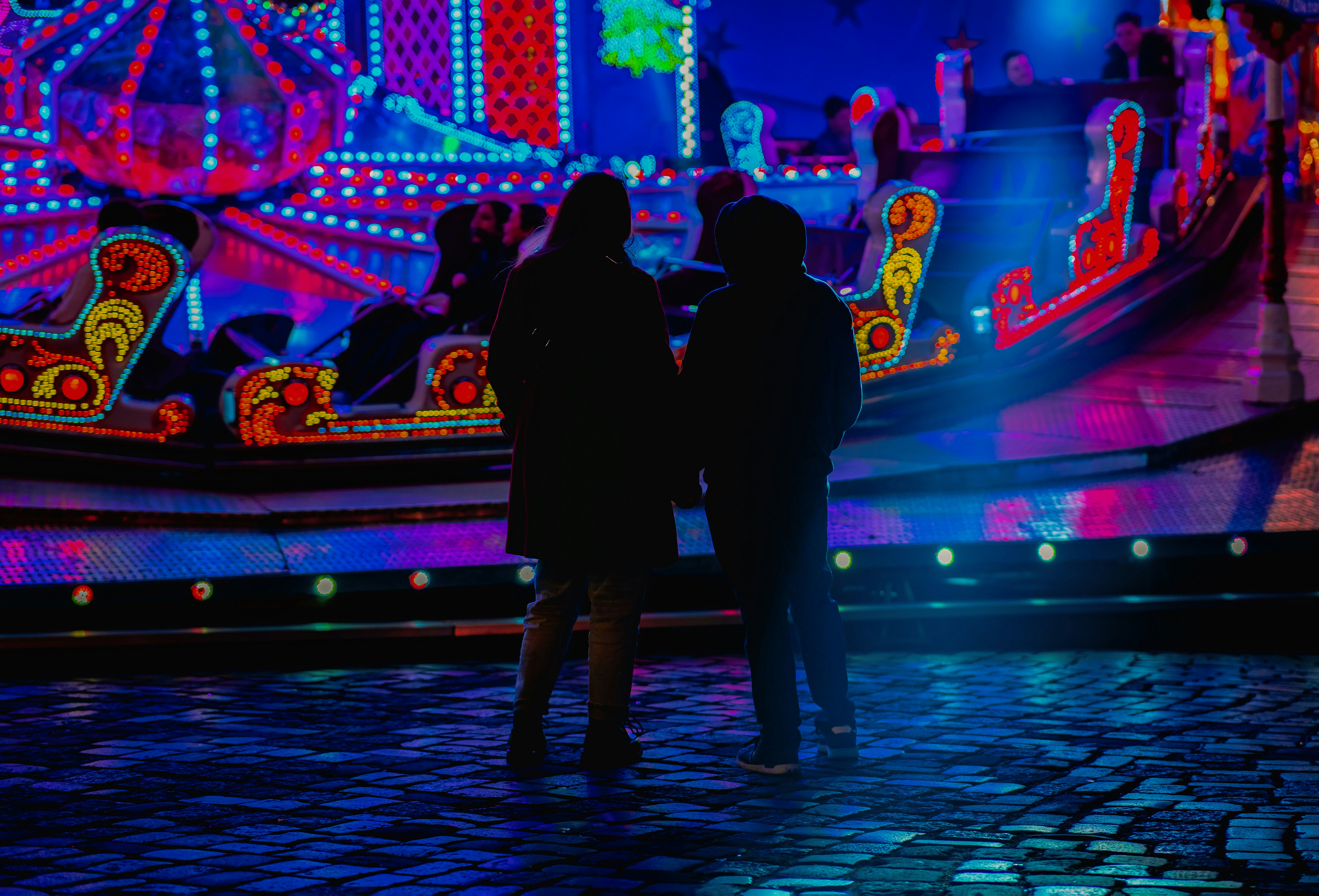 Midnight Carousel: Silhouettes in Neon Reverie