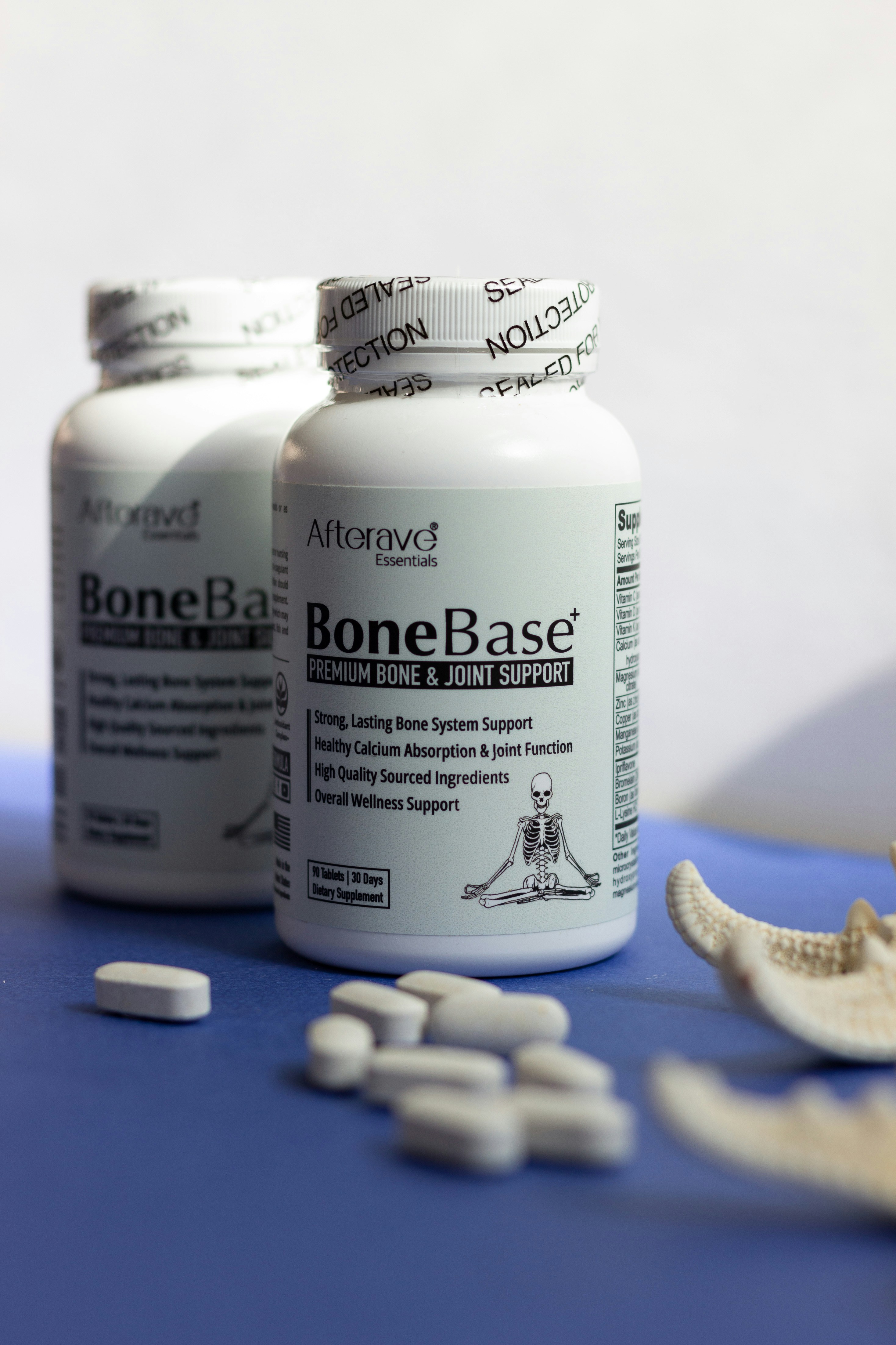 Two bottles of bonebasee sit next to a broken bone photo – Free ...