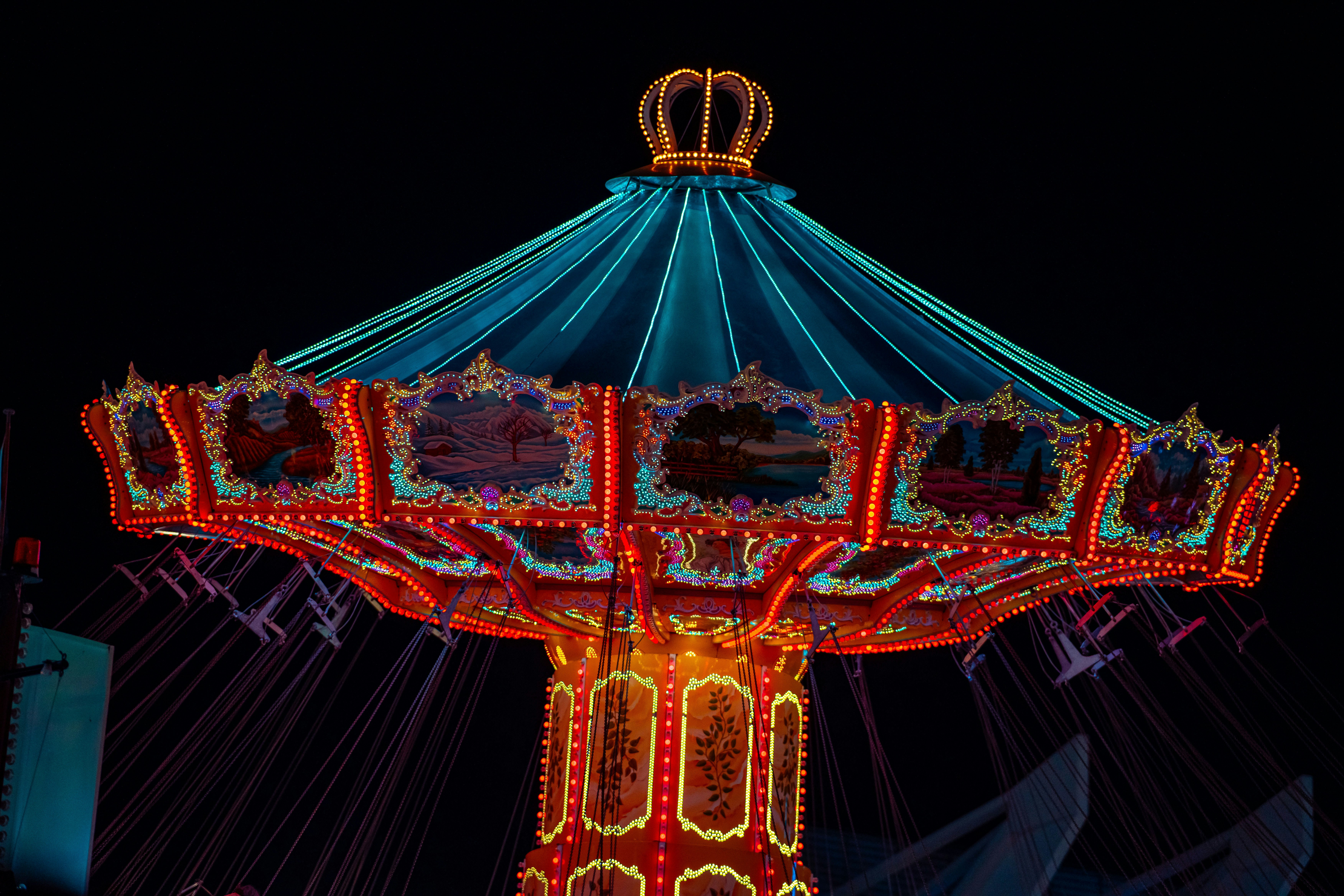 A merry go round ride lit up at night photo – Free Night Image on Unsplash
