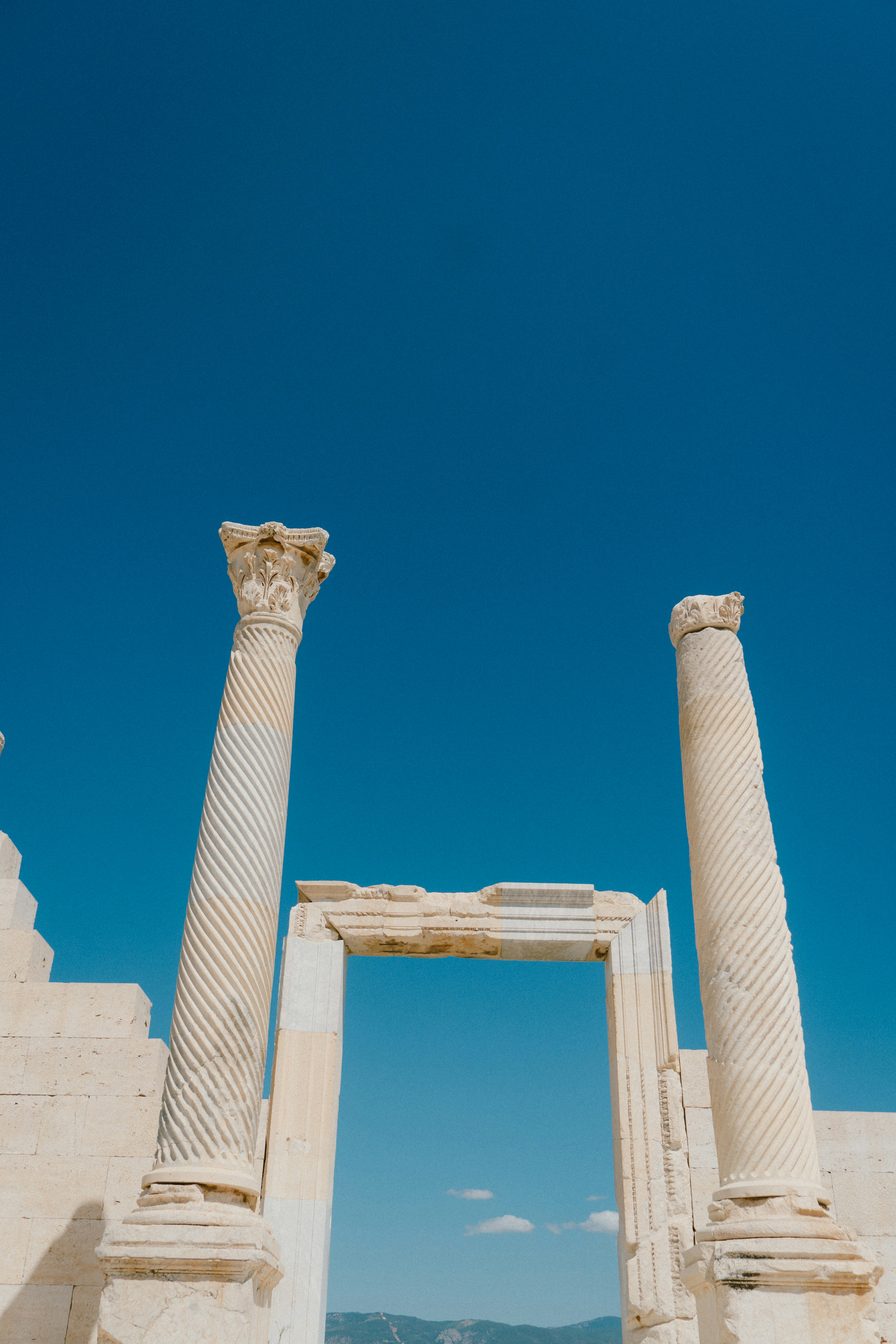 A couple of white pillars sitting next to each other