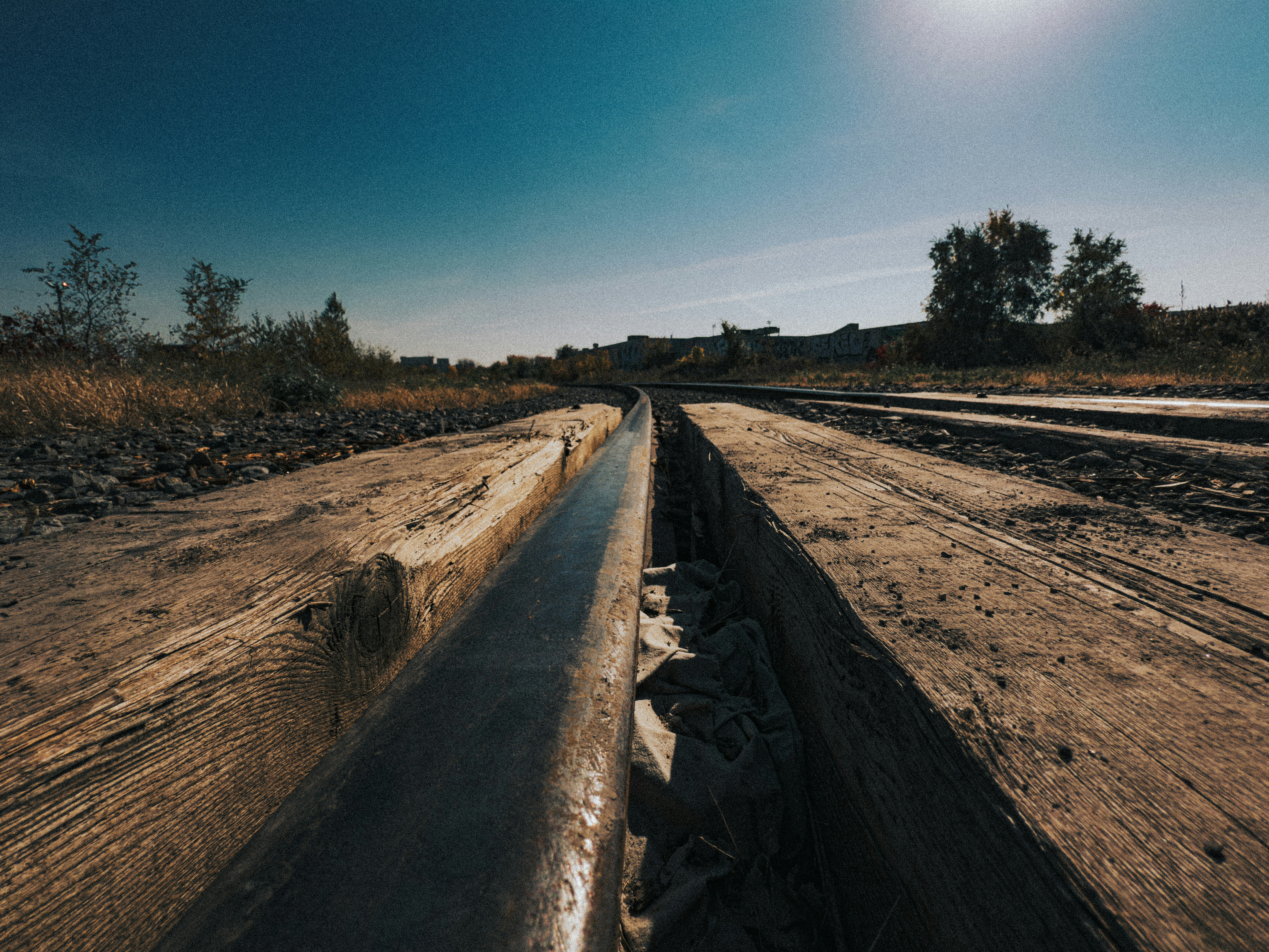 Rusted Rails Lead the Long View Across a Drought-Scorched Plain