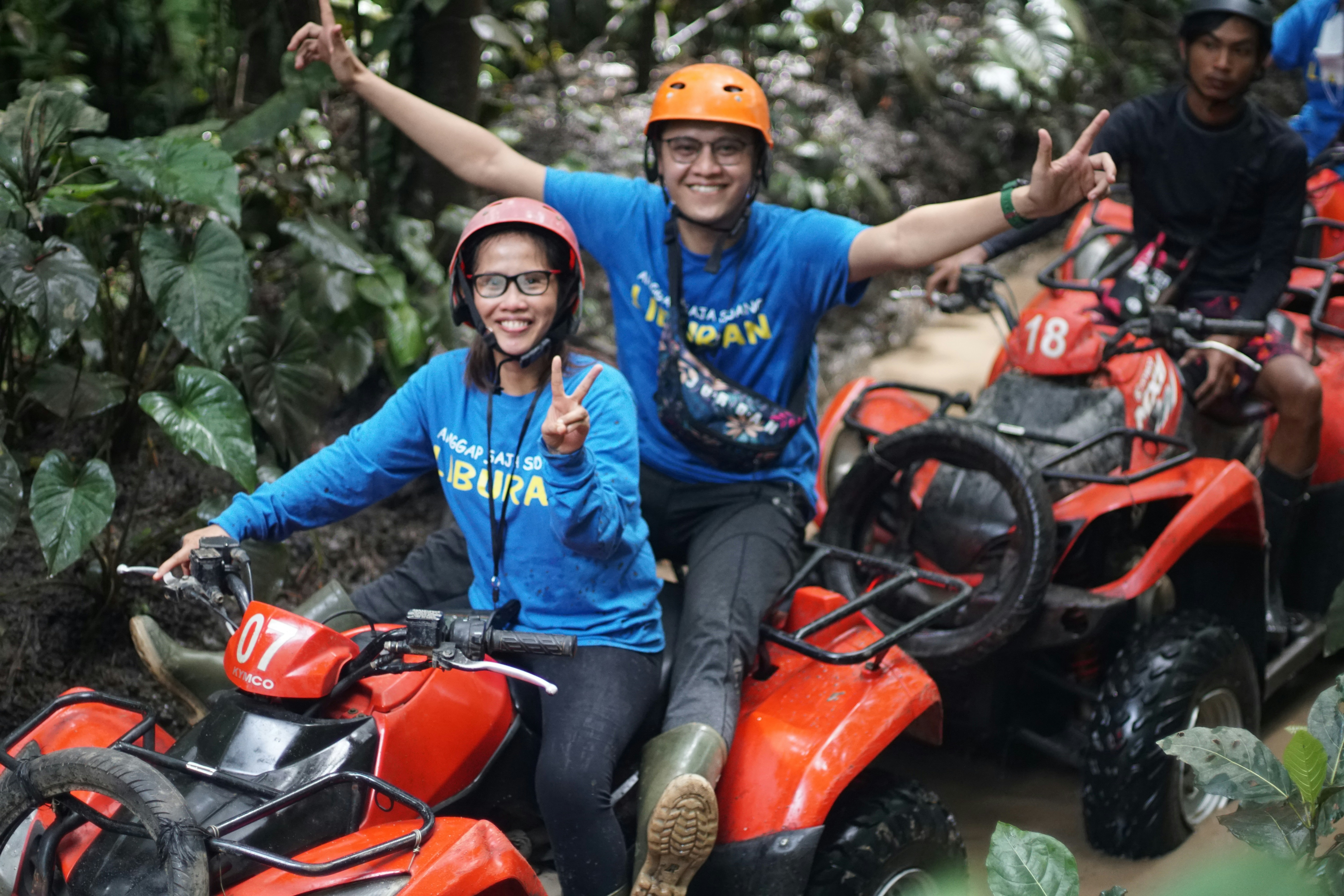 A man and a woman riding four wheelers in the jungle photo – Free Ubud ...