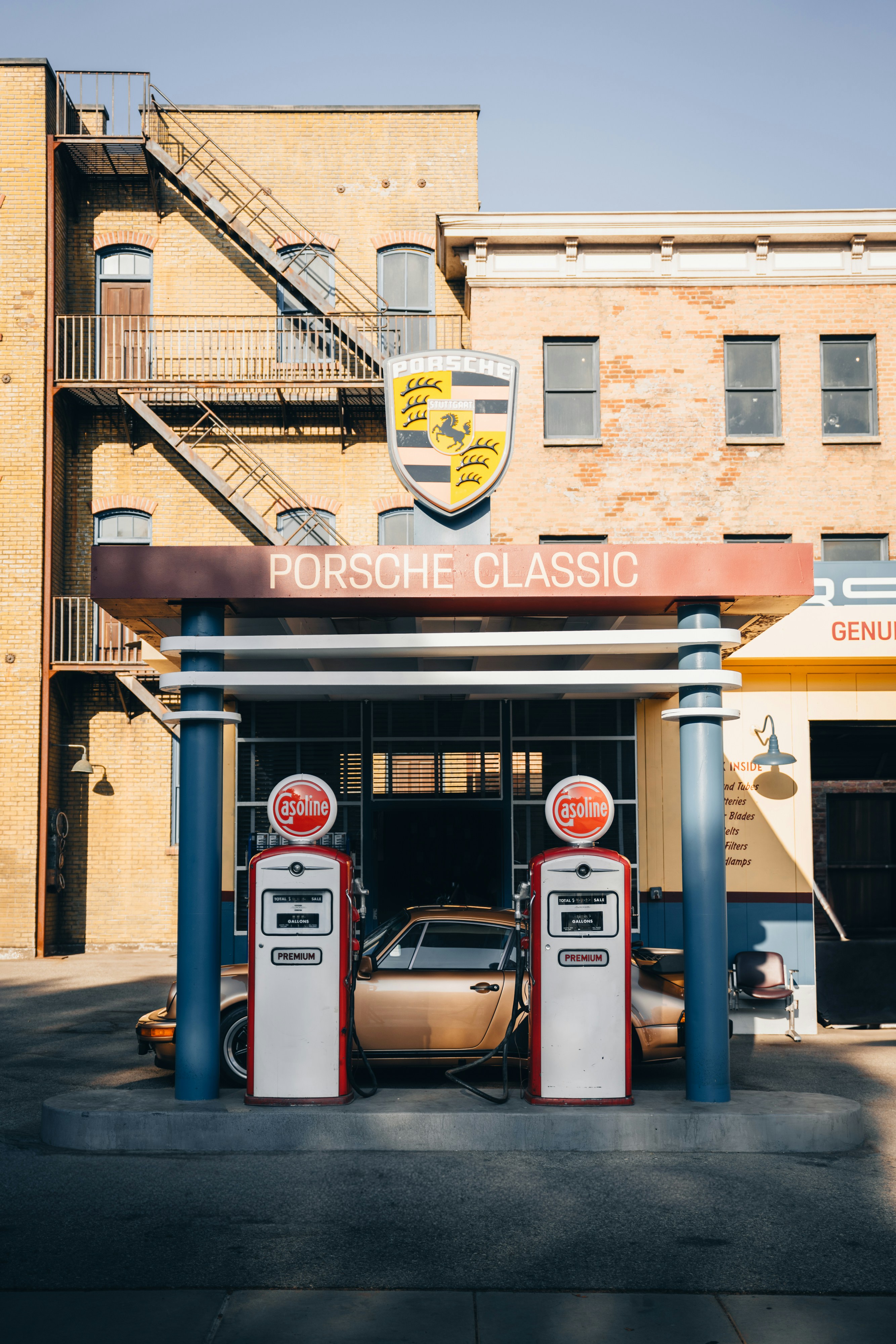 A couple of gas pumps sitting in front of a building photo – Free Universal studios hollywood ...