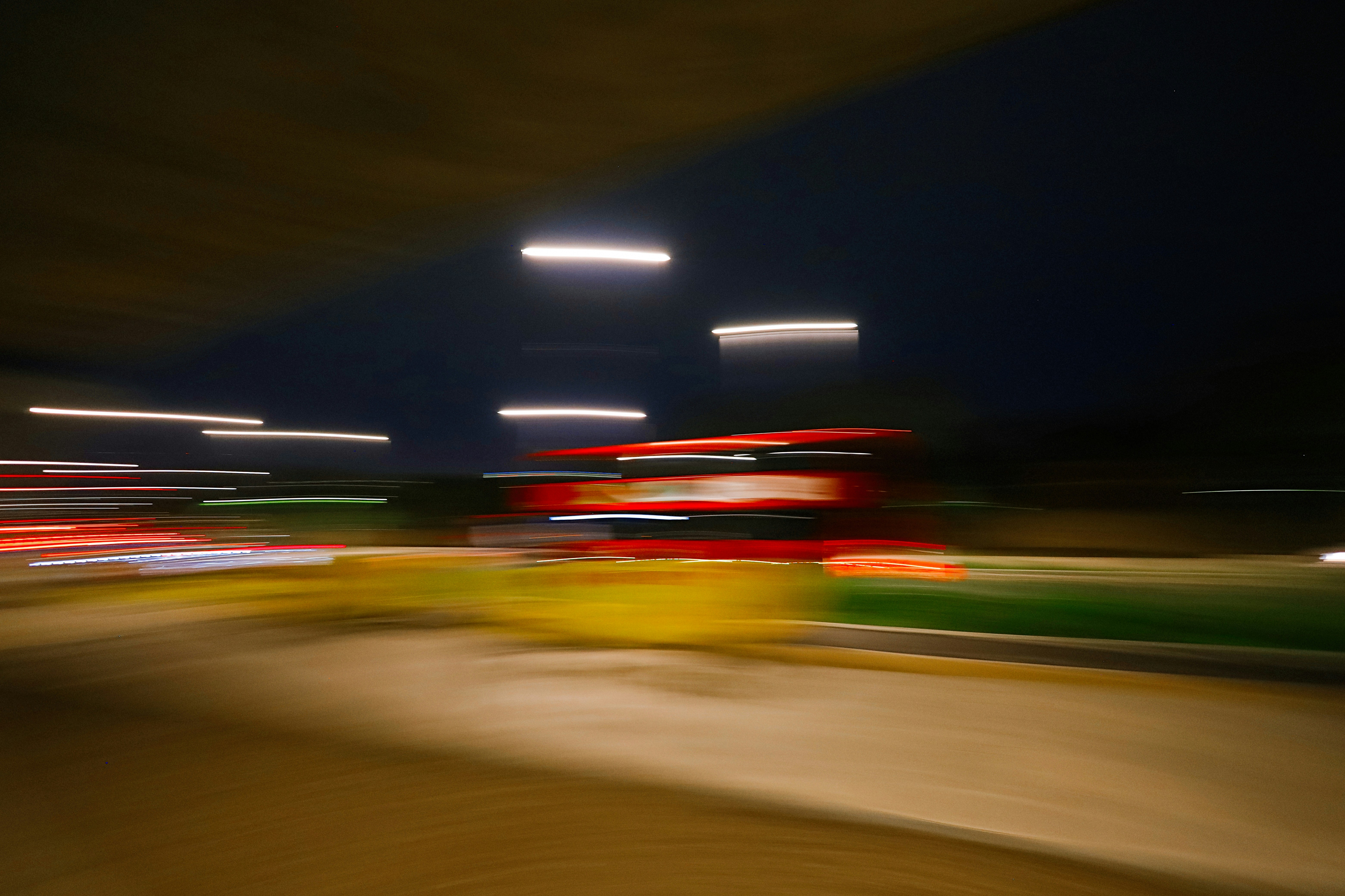 A blurry photo of a race track at night photo – Free West silvertown ...