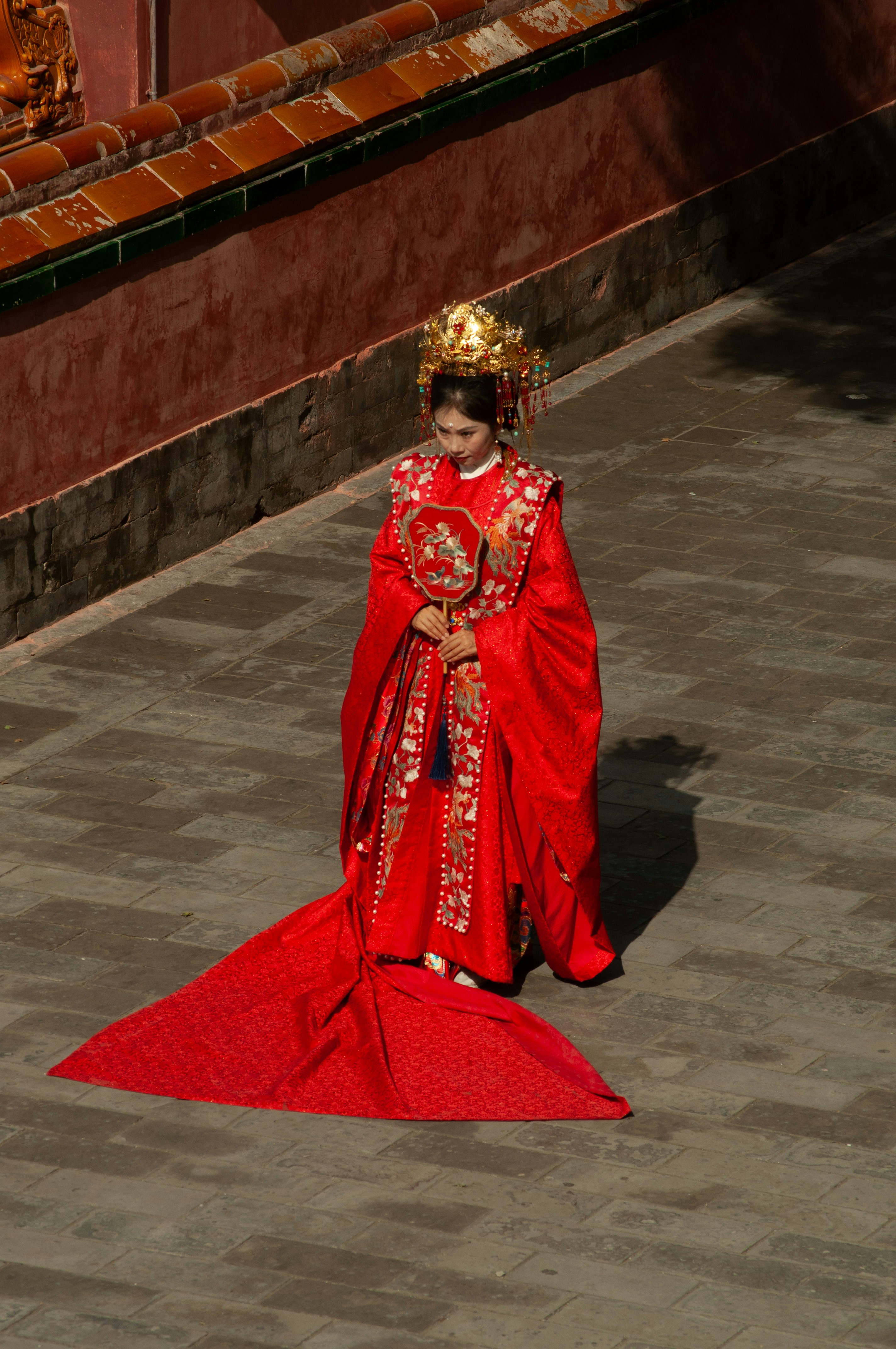 Crimson Empress in the Sunlit Courtyard