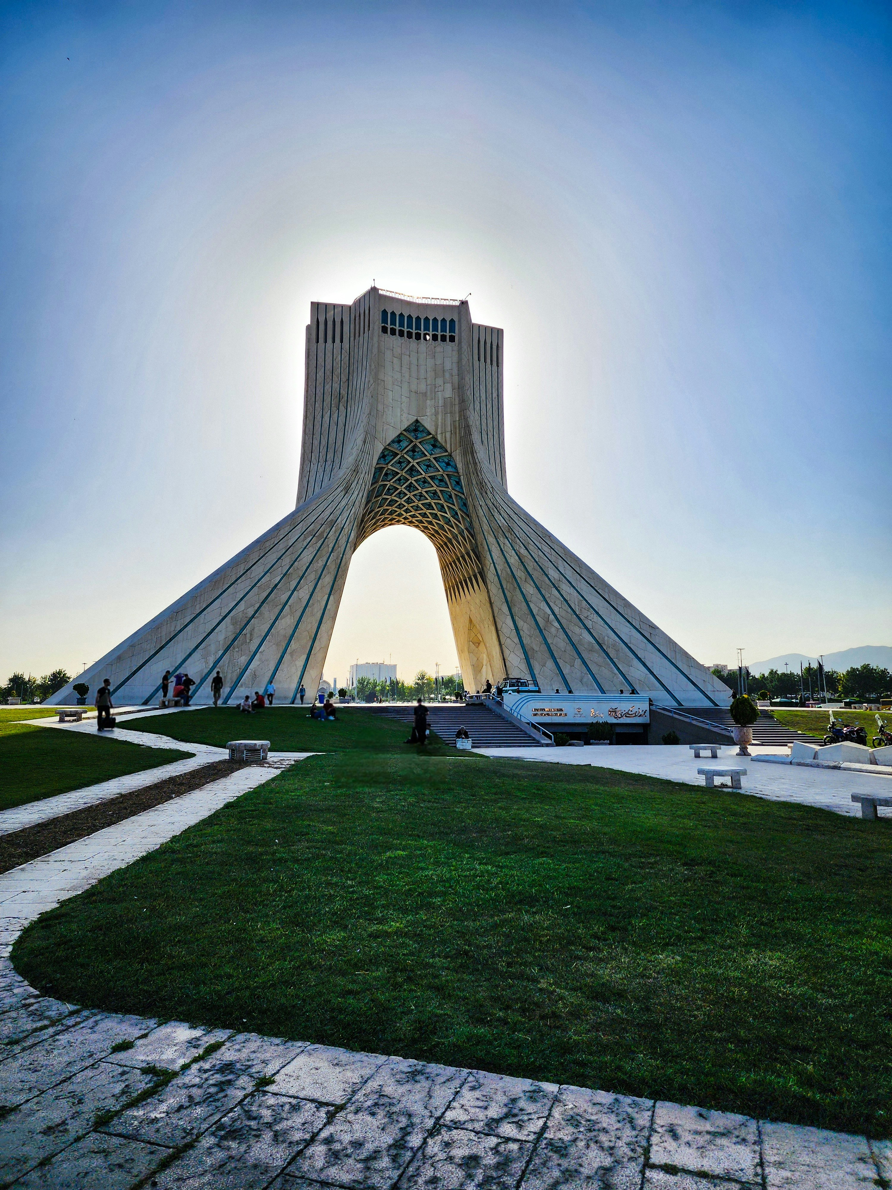"Azadi Tower in Tehran, a symbol of modern Iranian architecture and cultural heritage. Capturing the elegance and symmetry of this iconic monument during clear sky, highlighting its grandeur against the vibrant cityscape."
