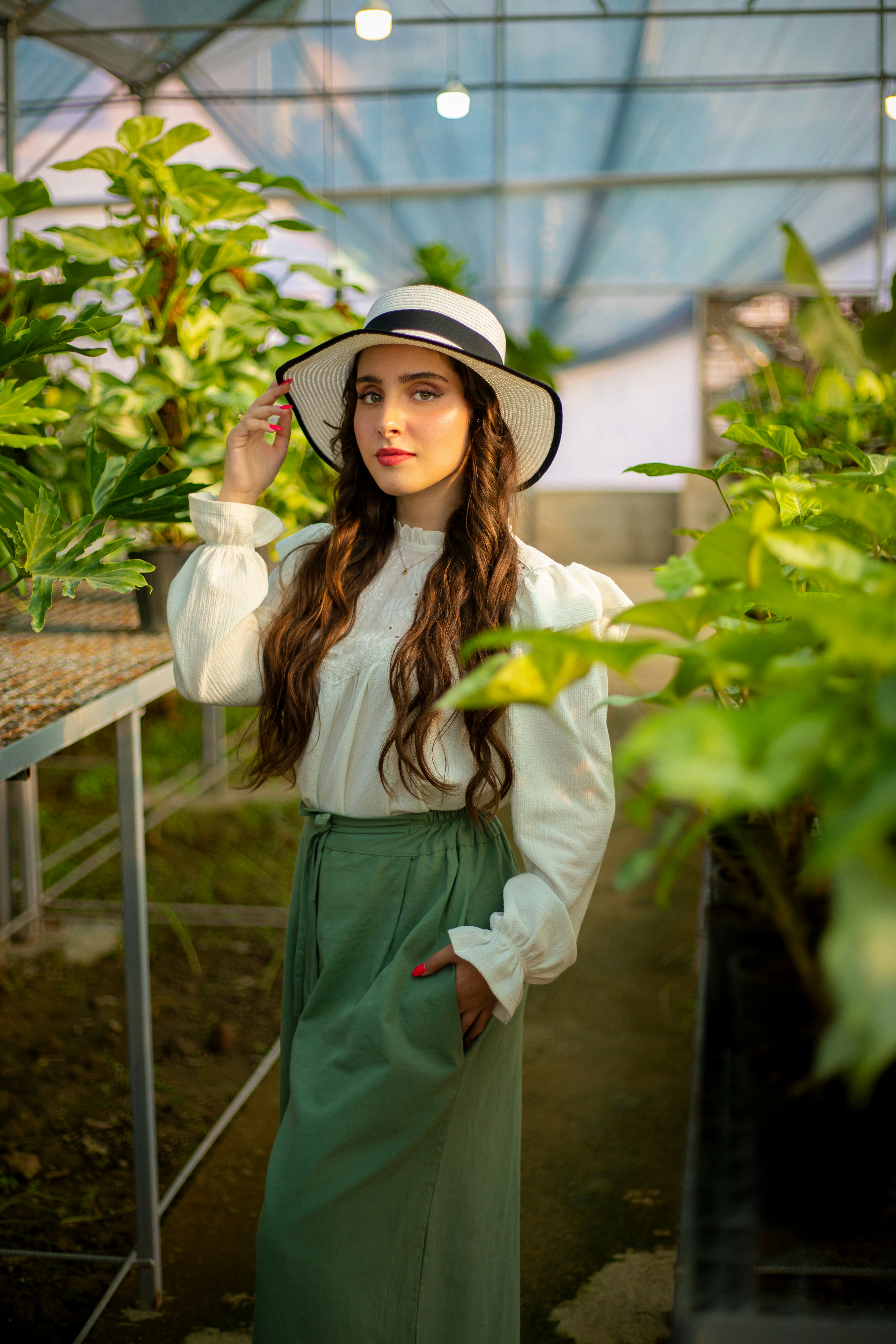 Portrait in Greenery: A Sunlit Moment Under Glass
