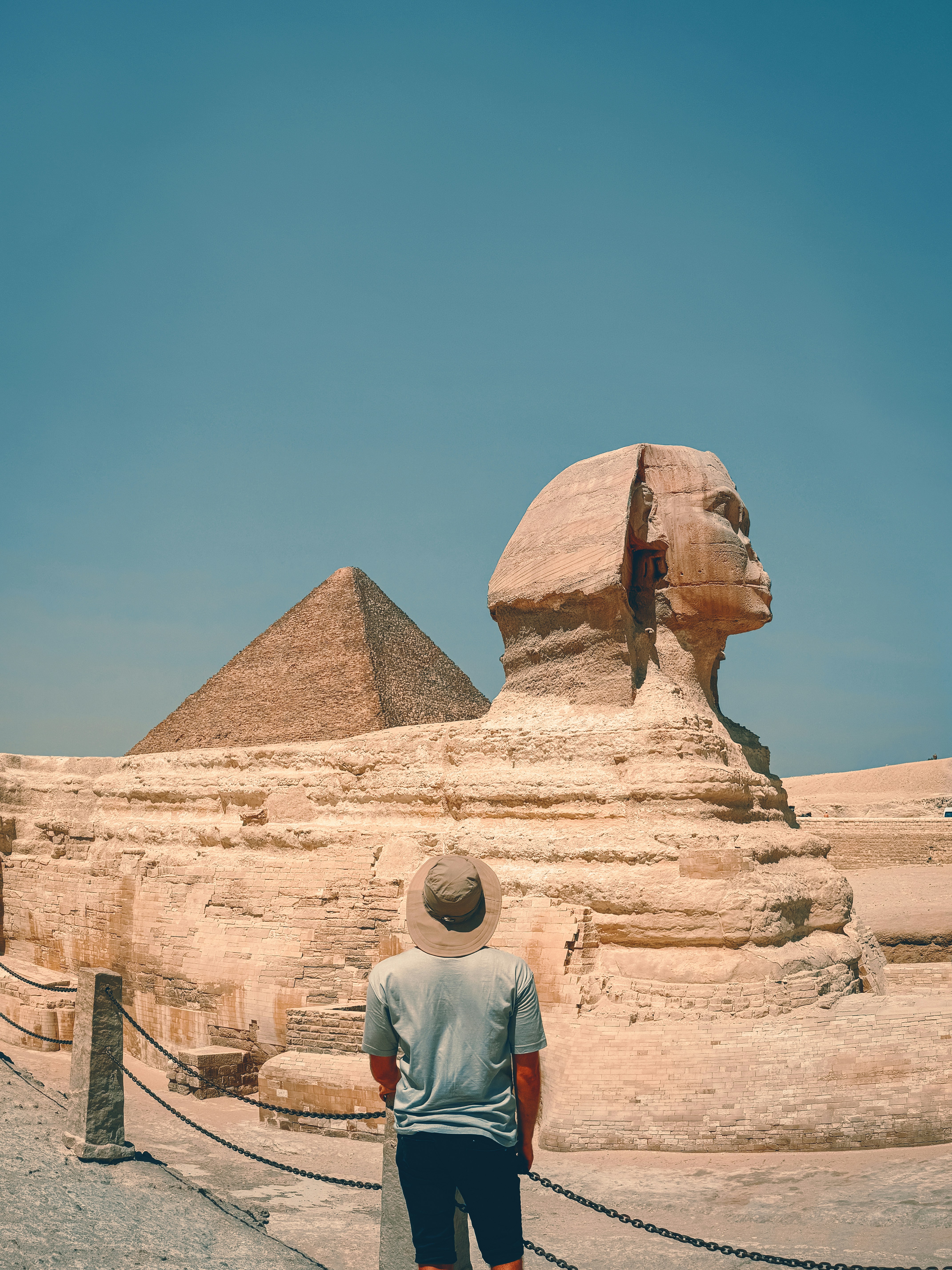 A man standing in front of a large sphinx photo – Free Man Image on ...