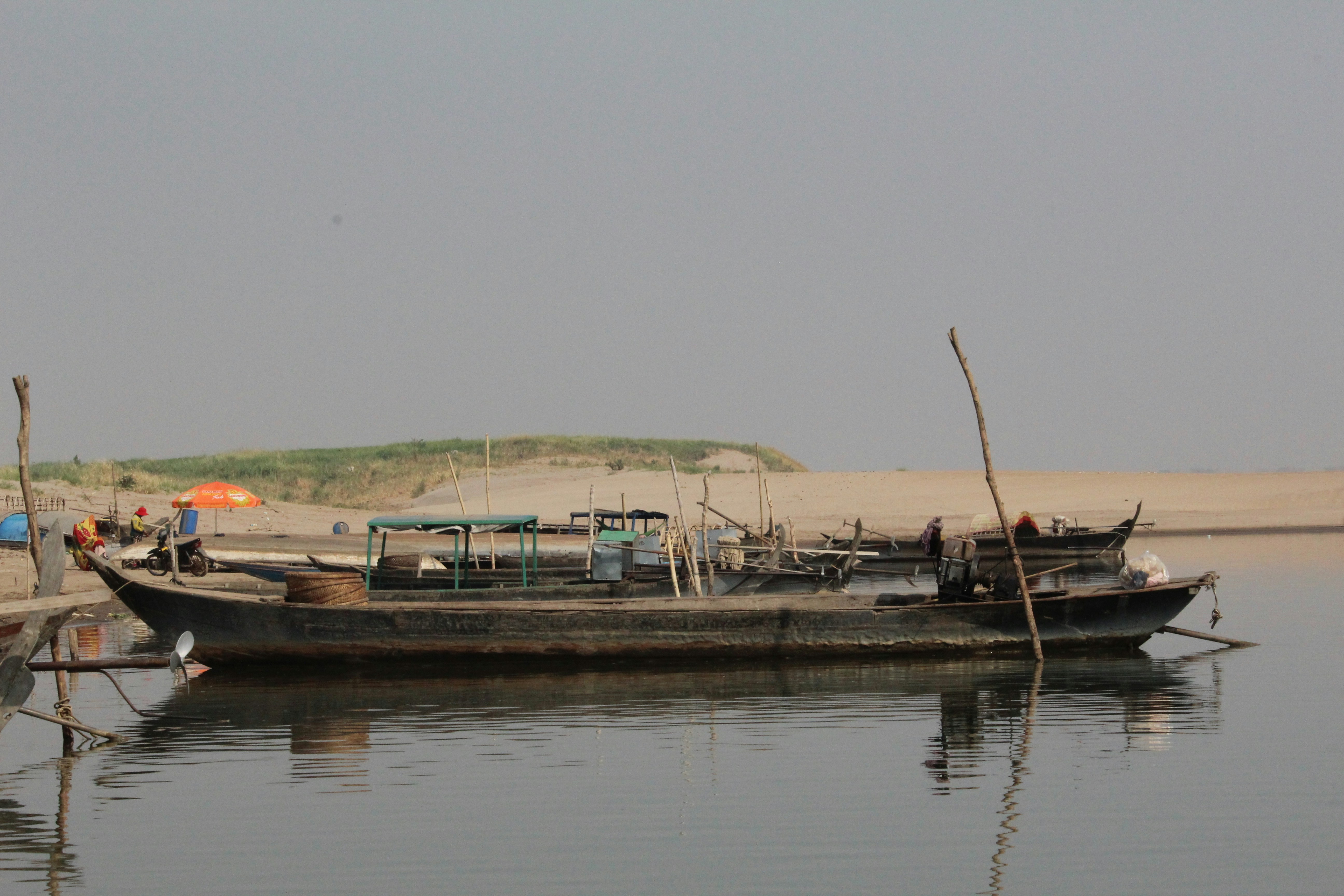 Weathered Fleet Resting at the Sandbar Edge