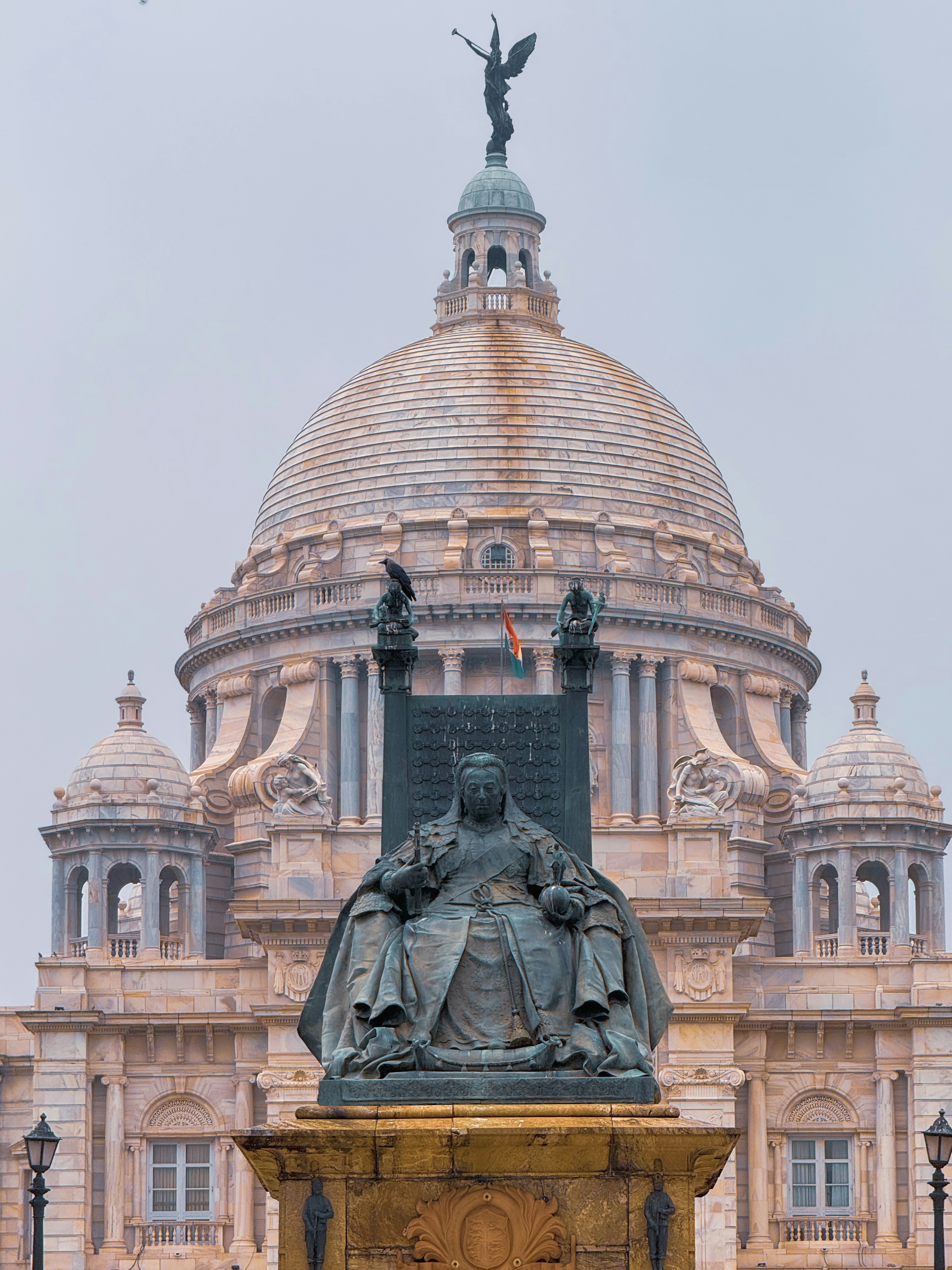 Statue Front and Dome Vista: A Monumental Portrait Framed by the State Capitol