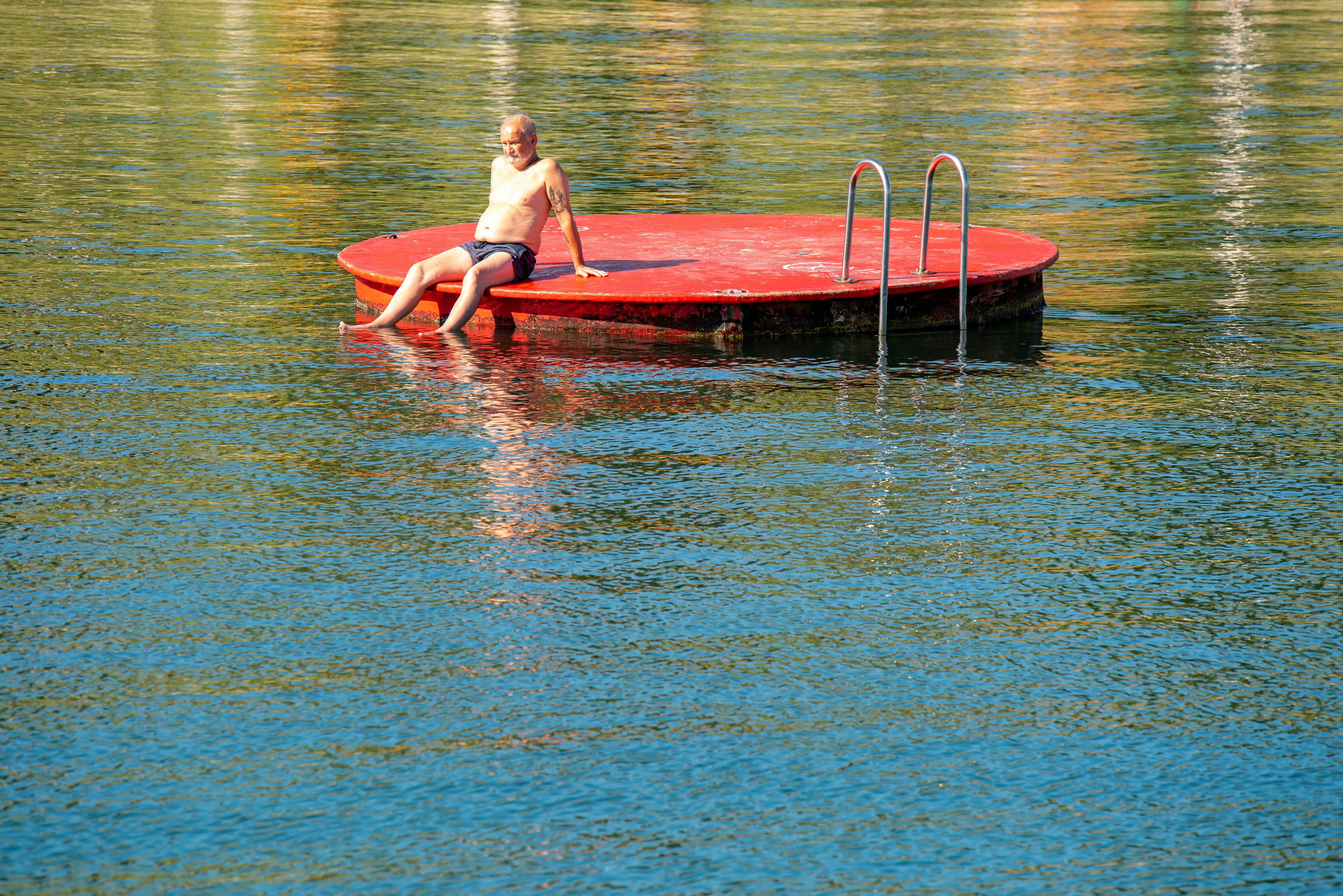 A man relaxes at the swimming baths at the Geelong waterfront in Victoria, Auatralia.