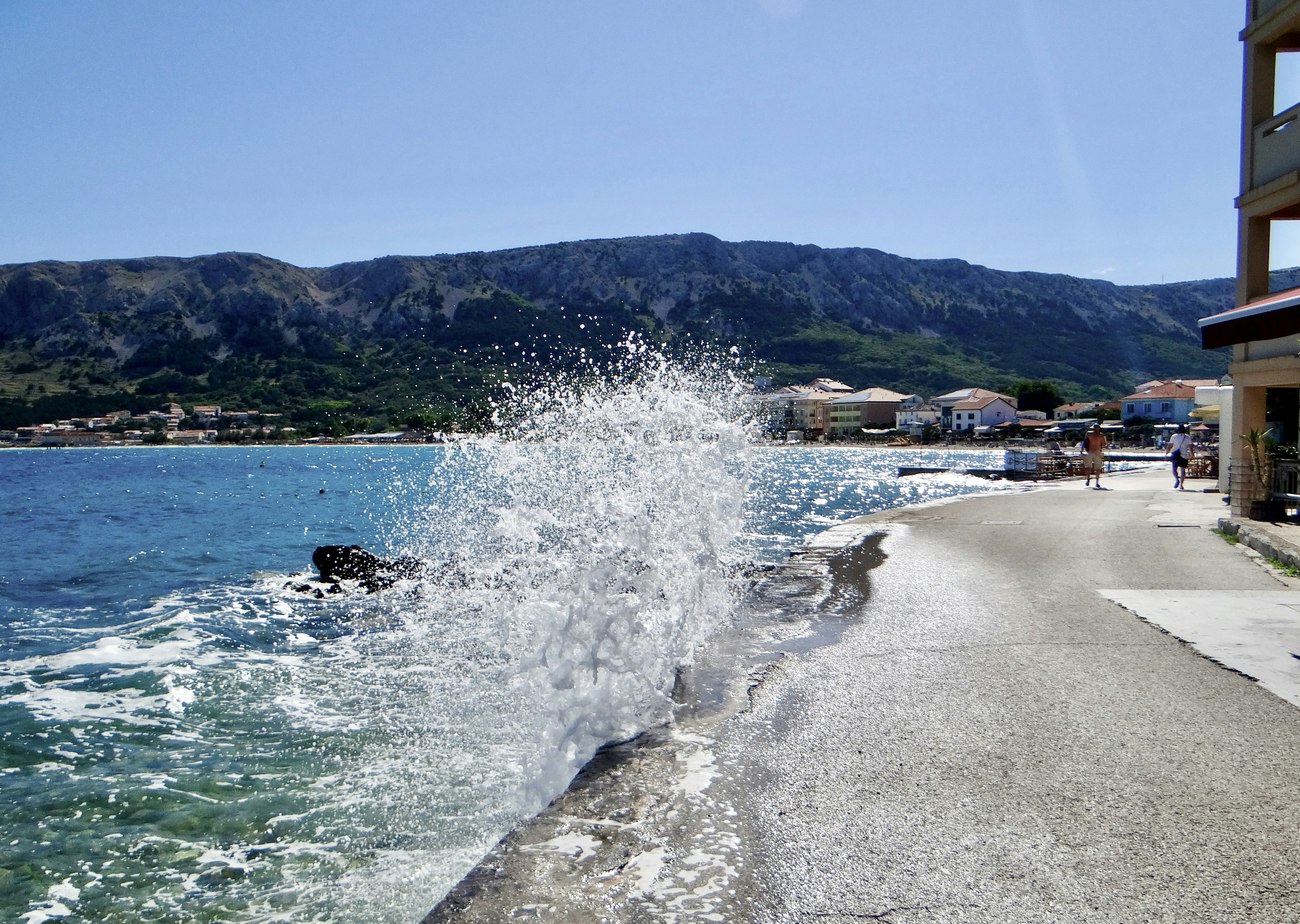 Sea Spray at the Shoreline: A sunlit Mediterranean-tinged Promenade