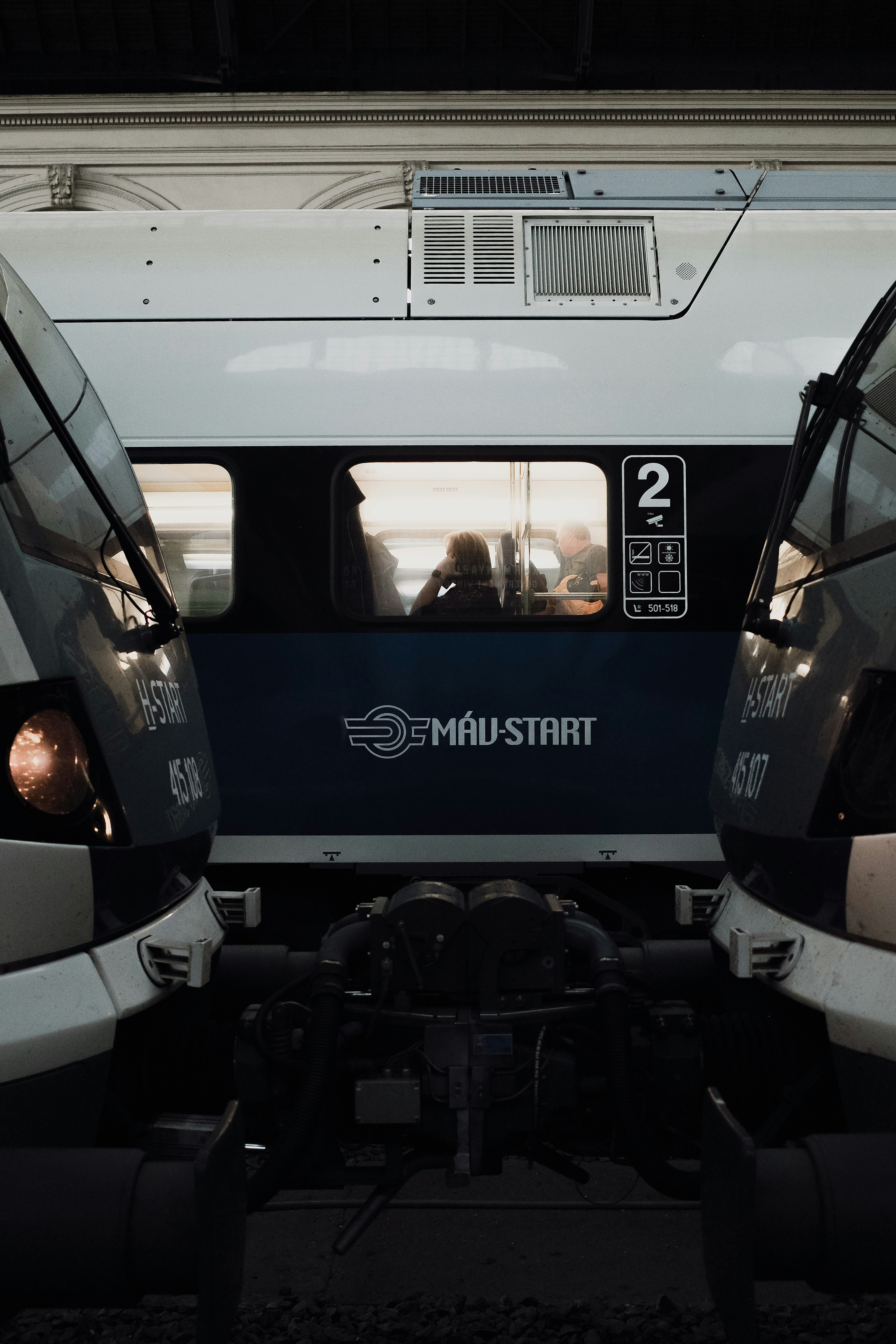 A couple of trains sitting next to each other photo – Free Budapest ...