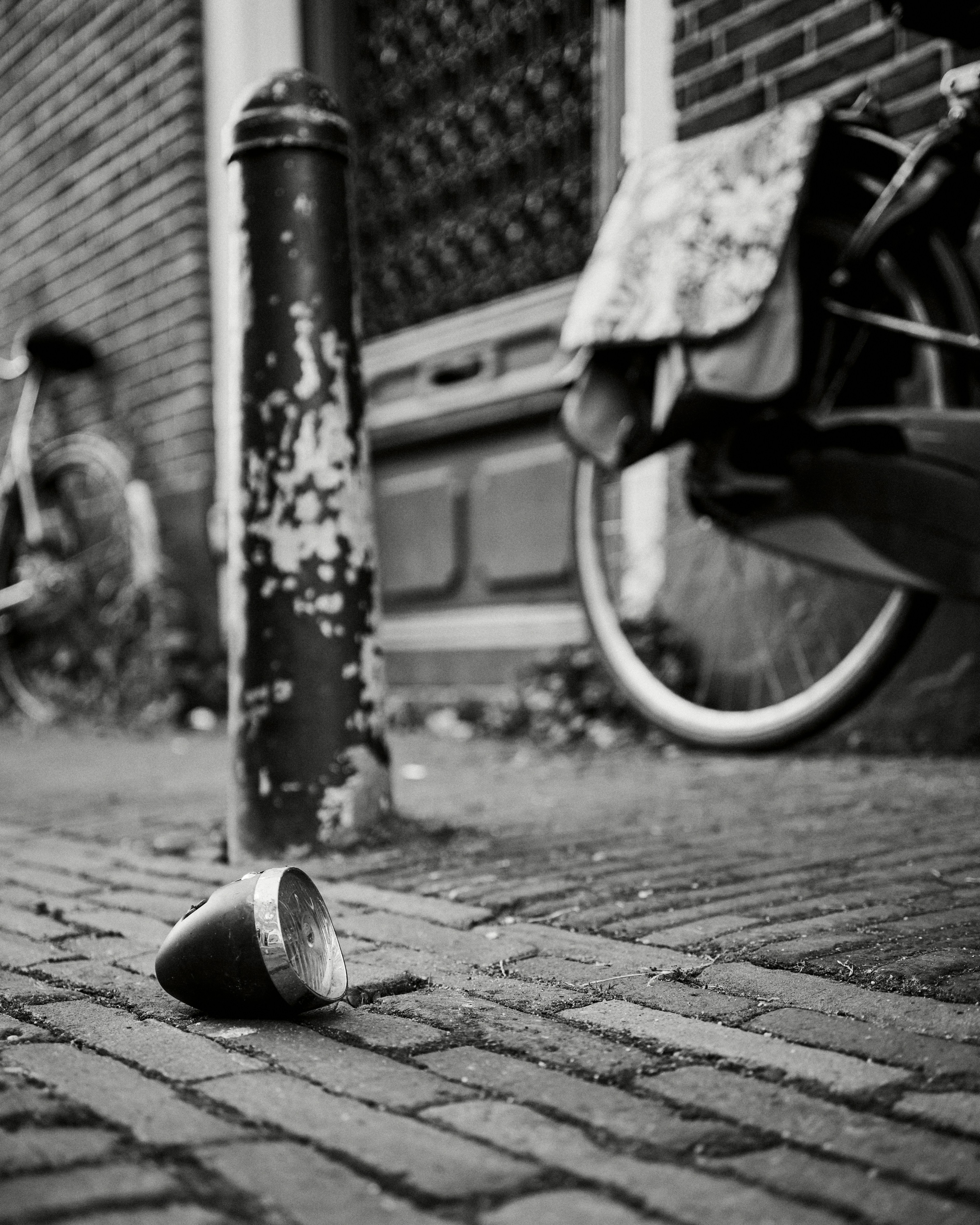 The Lone Cup on Bricked Ground: Quiet Grit in Monochrome