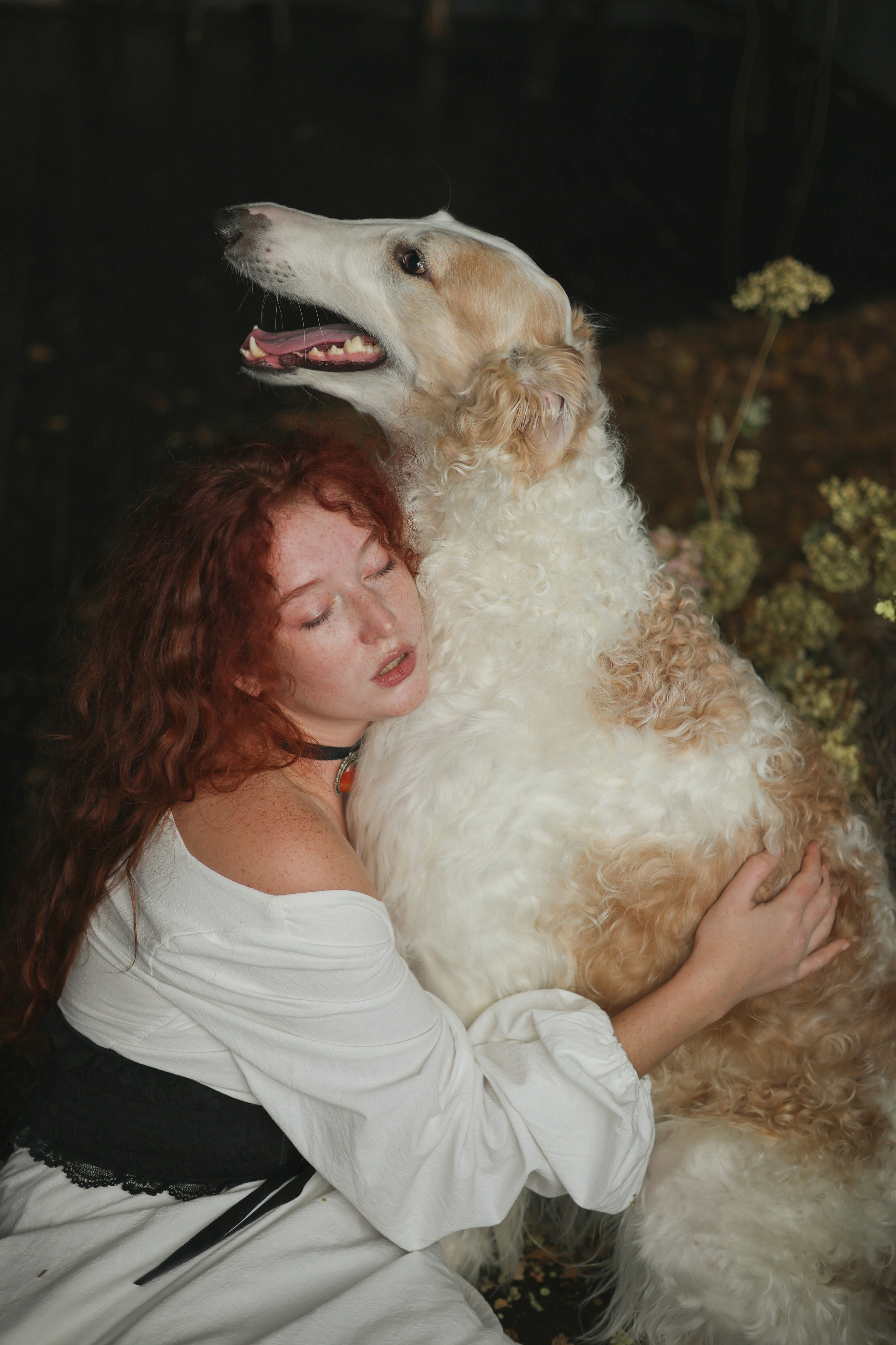 Moonlit Hug: A Redhead and Her Golden Companion