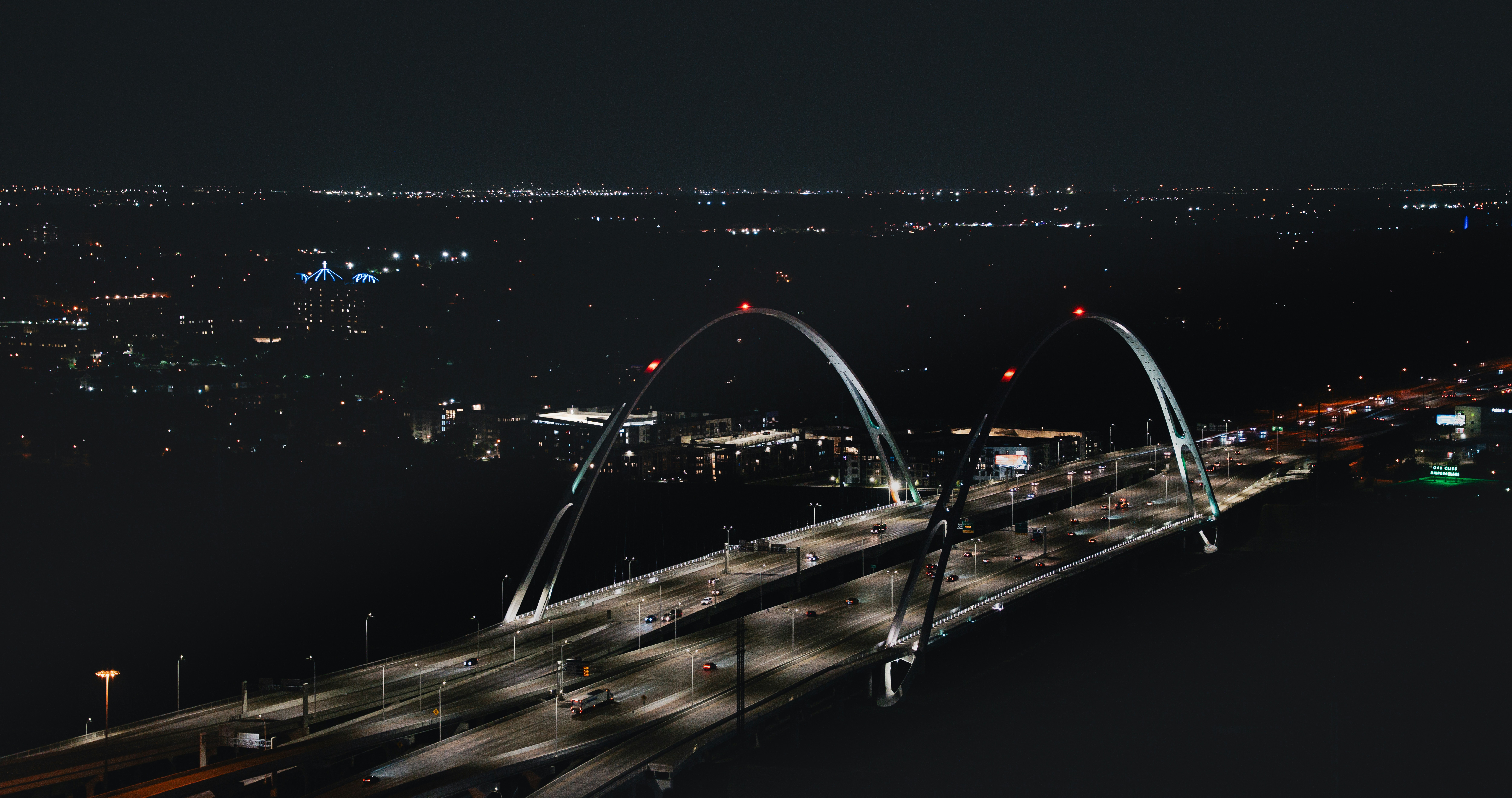 Twin-Arch Night Bridge: Light Trails Over a Quiet River