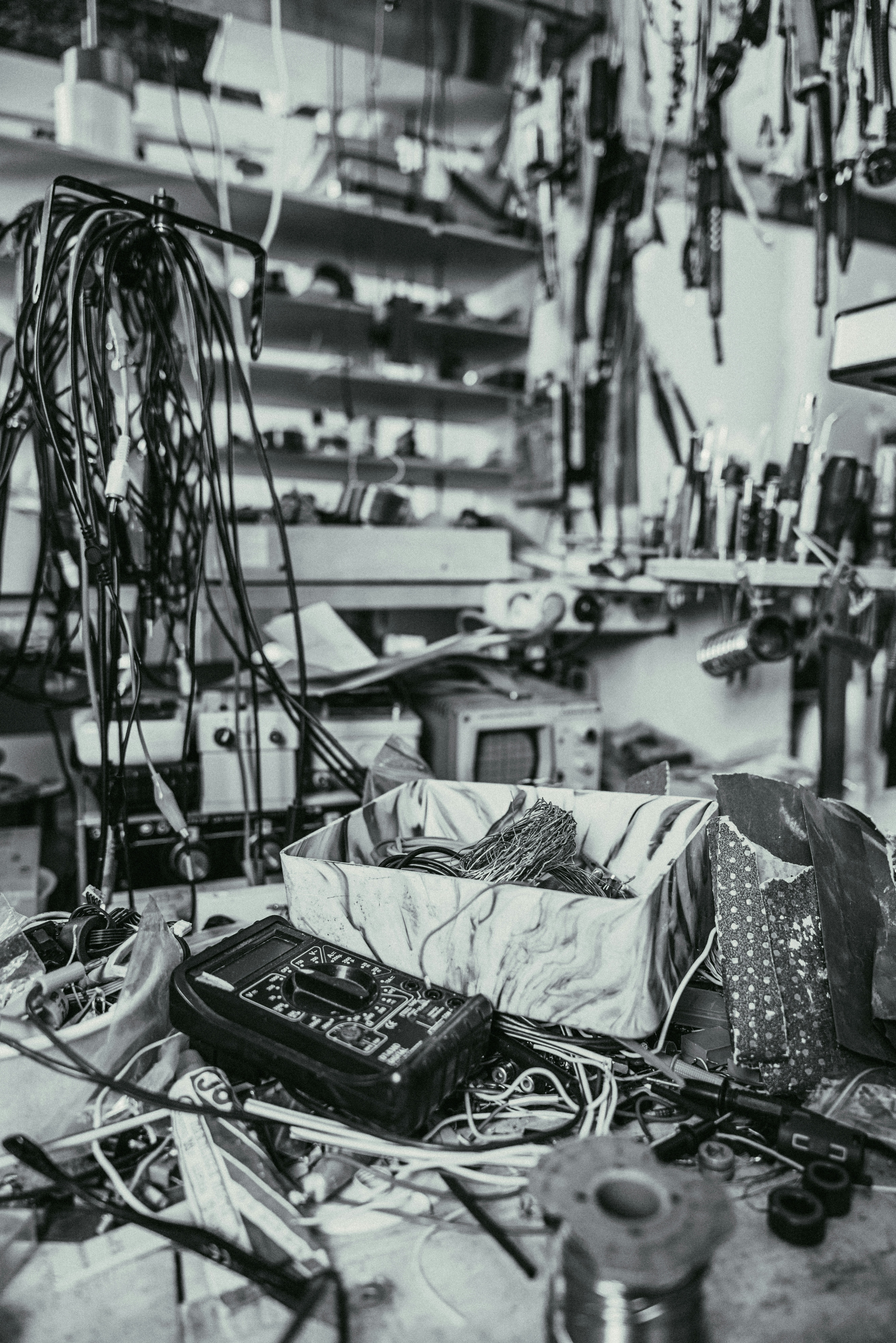 Messy Bench, Quiet Mechanisms: A Tangle of Tools and Cables