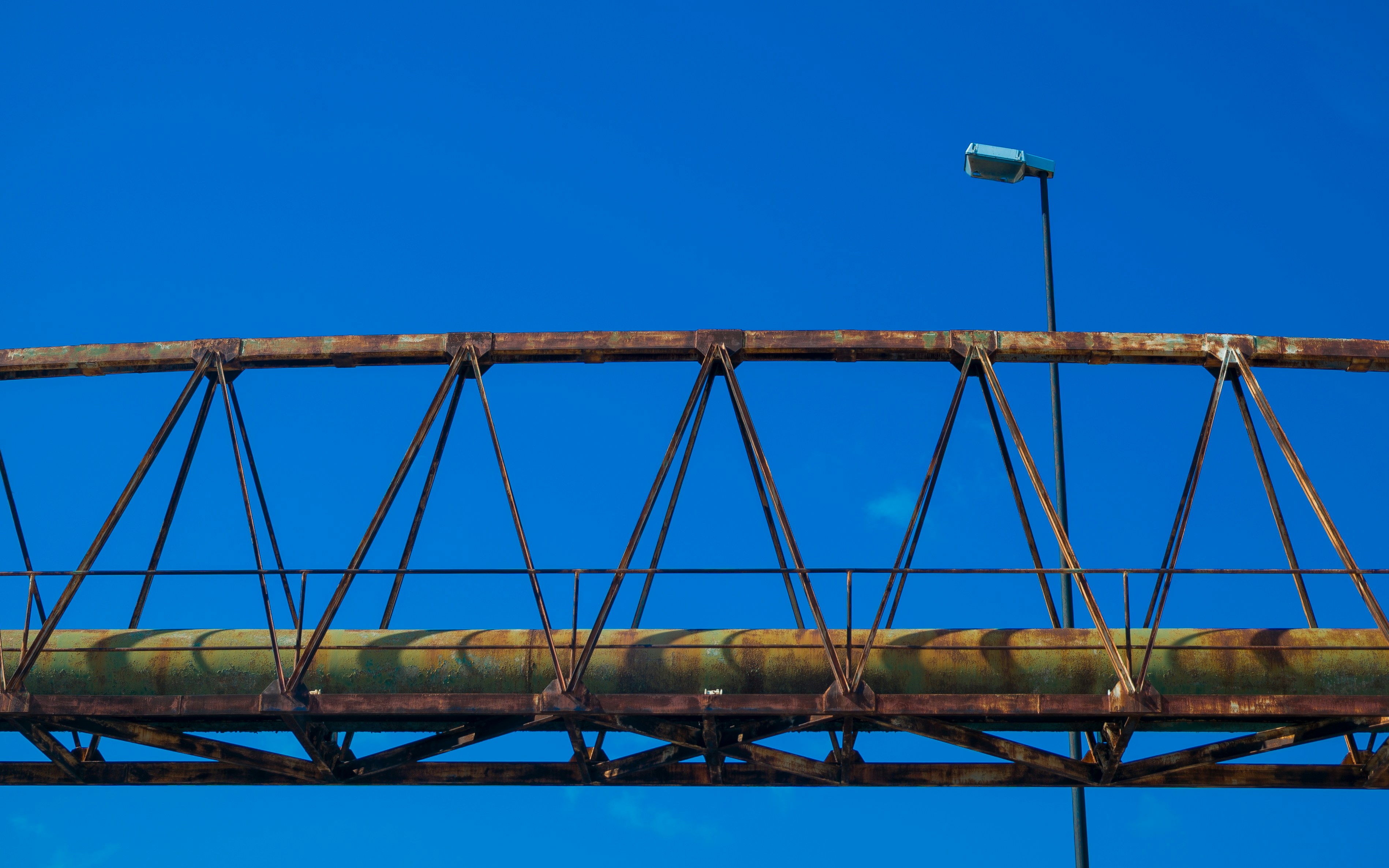 An old rusty bridge with a stop sign on it photo – Free Rust Image on ...