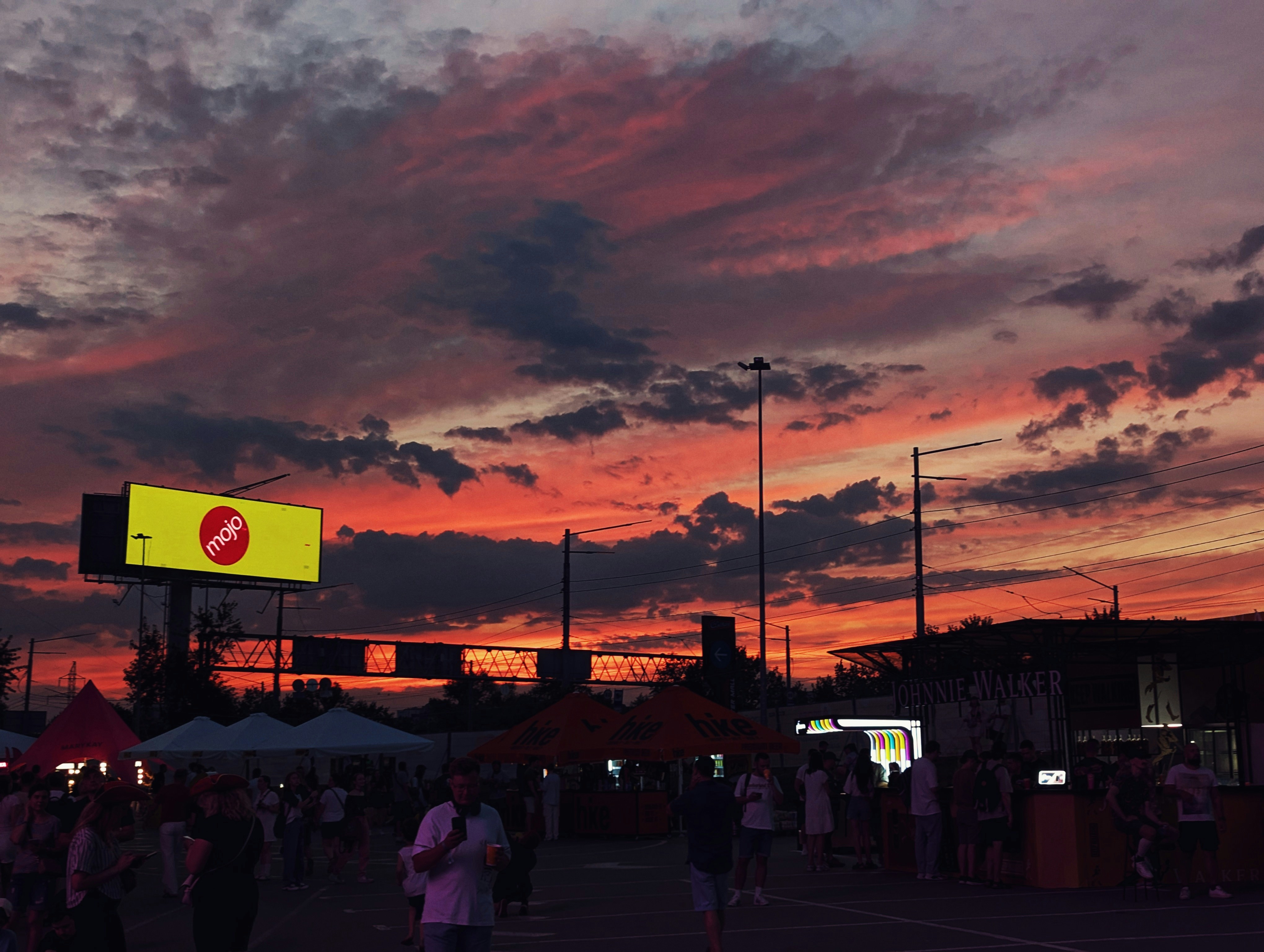 Crimson Skyline Over a Sunset Market Festival