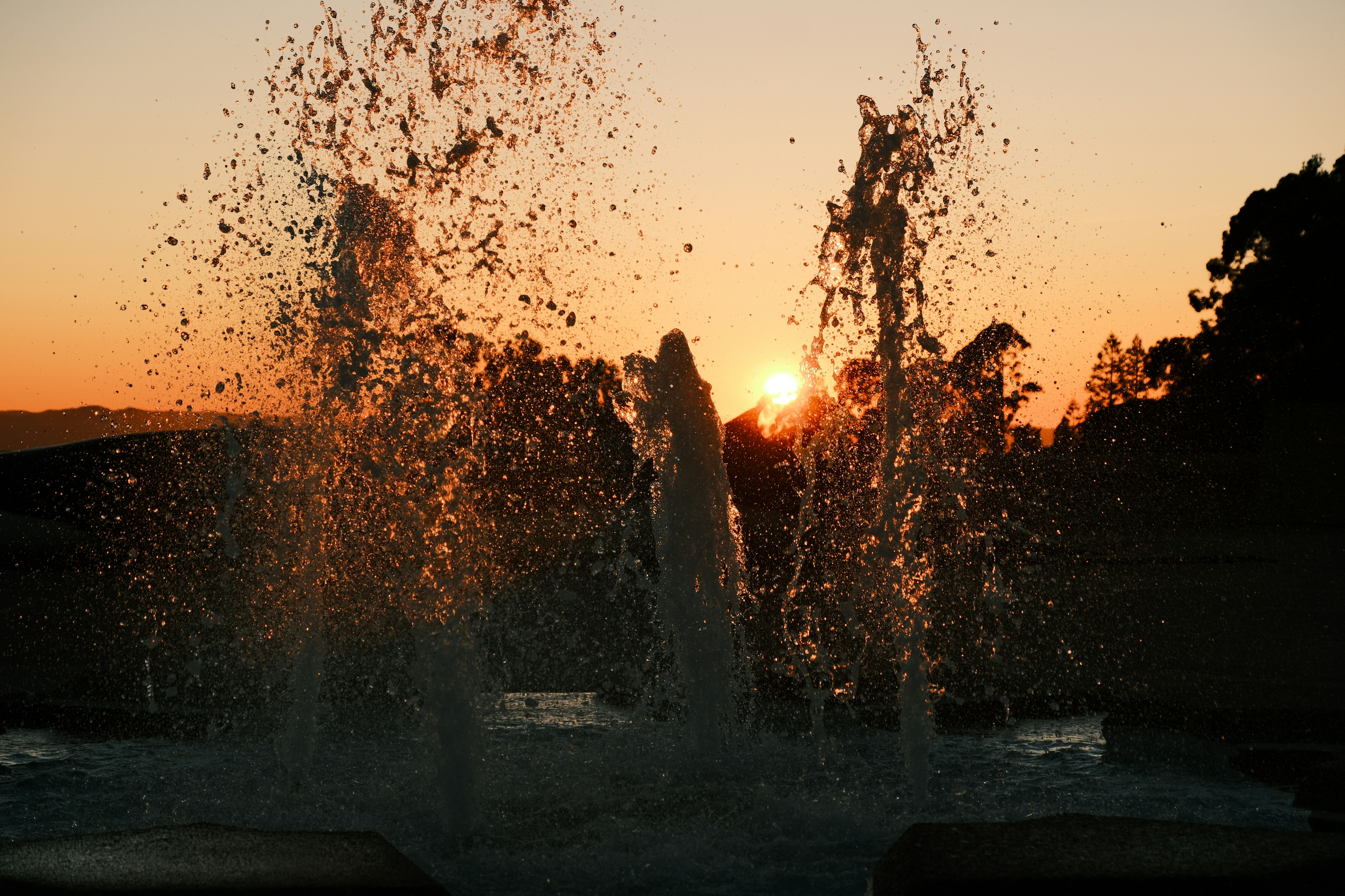 Sunset Fountain Burst: Silhouettes and Spray