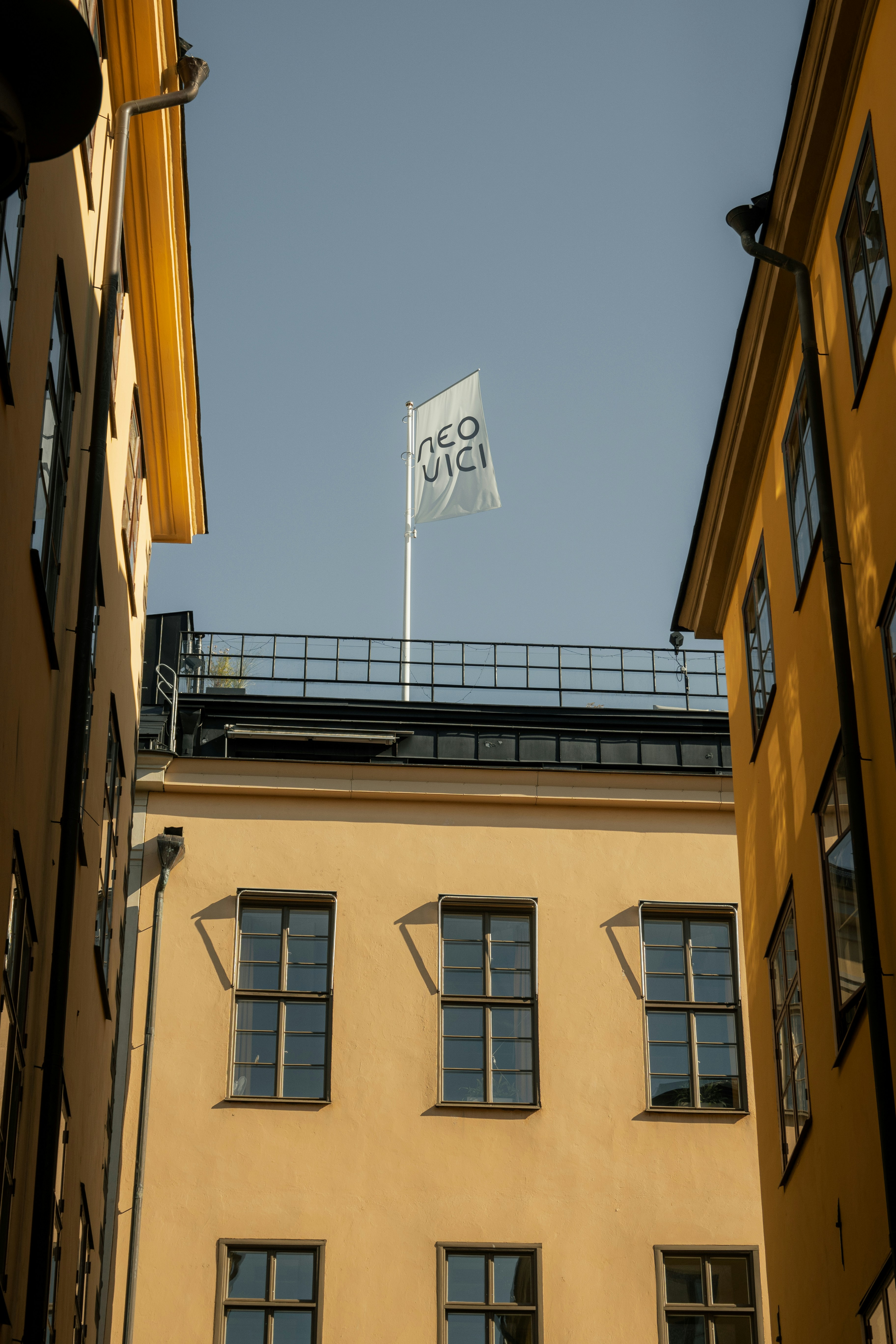Flag Above the Narrow Canyon: An Architectural Portrait in Ochre