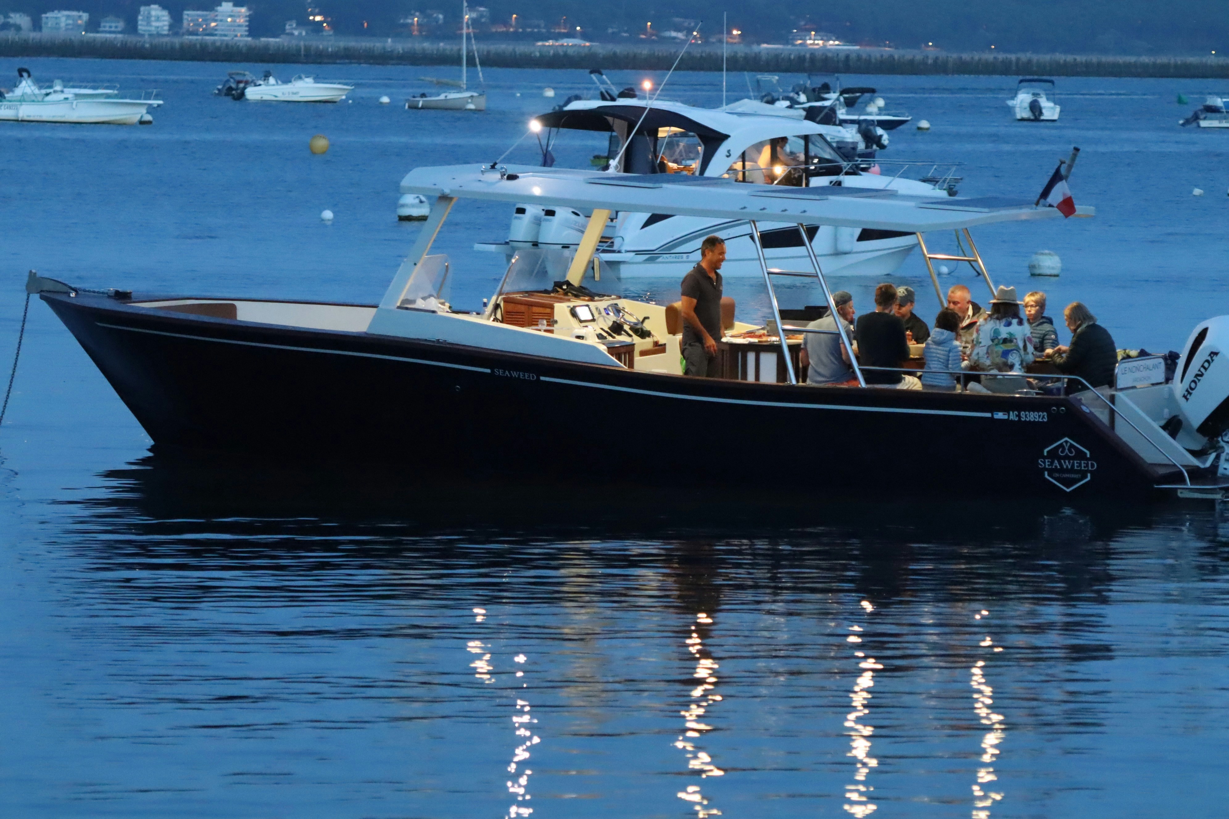 Evening Crescendo on a Black-Hulled Charter Boat