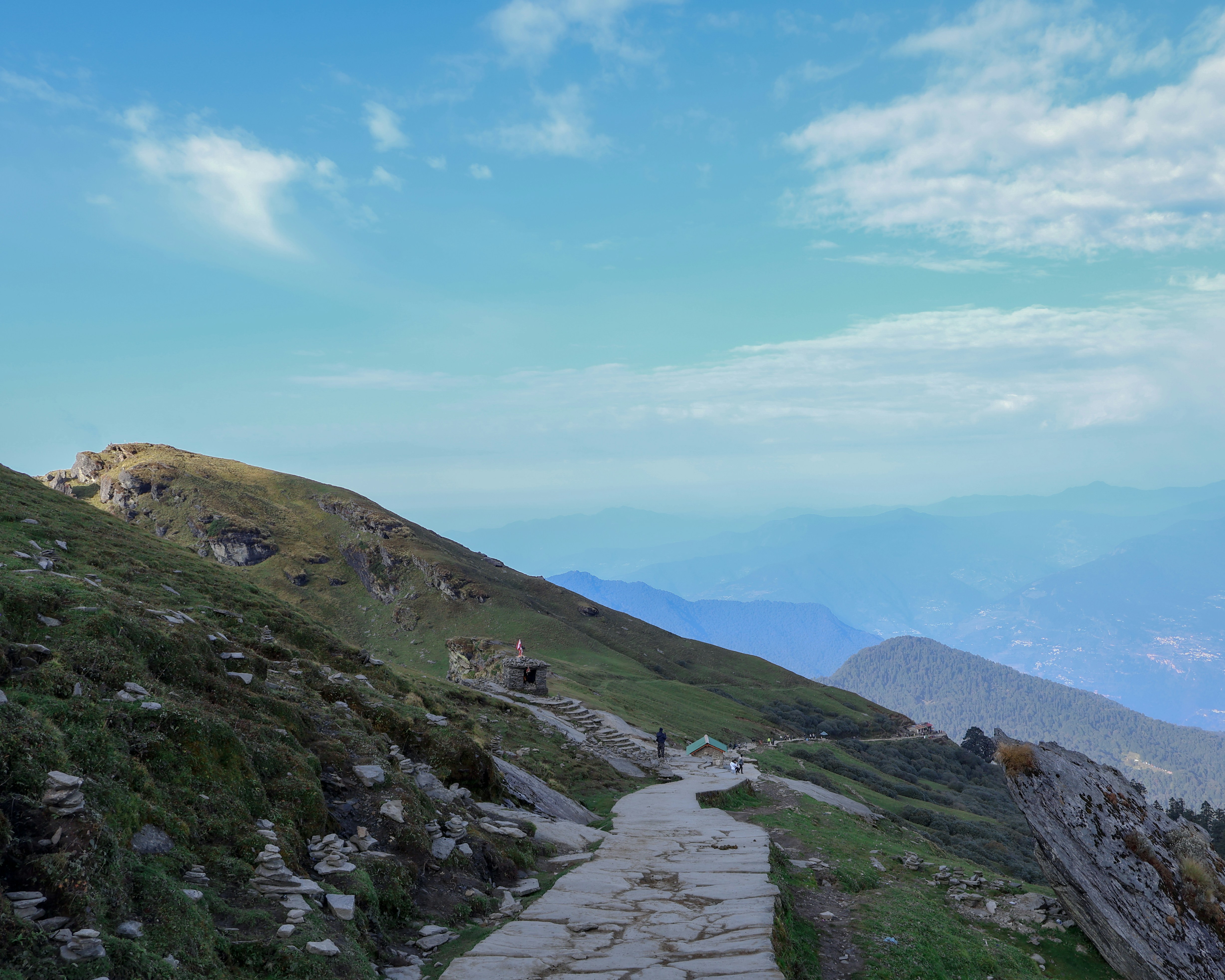 A path going up a hill with a mountain in the background photo – Free ...