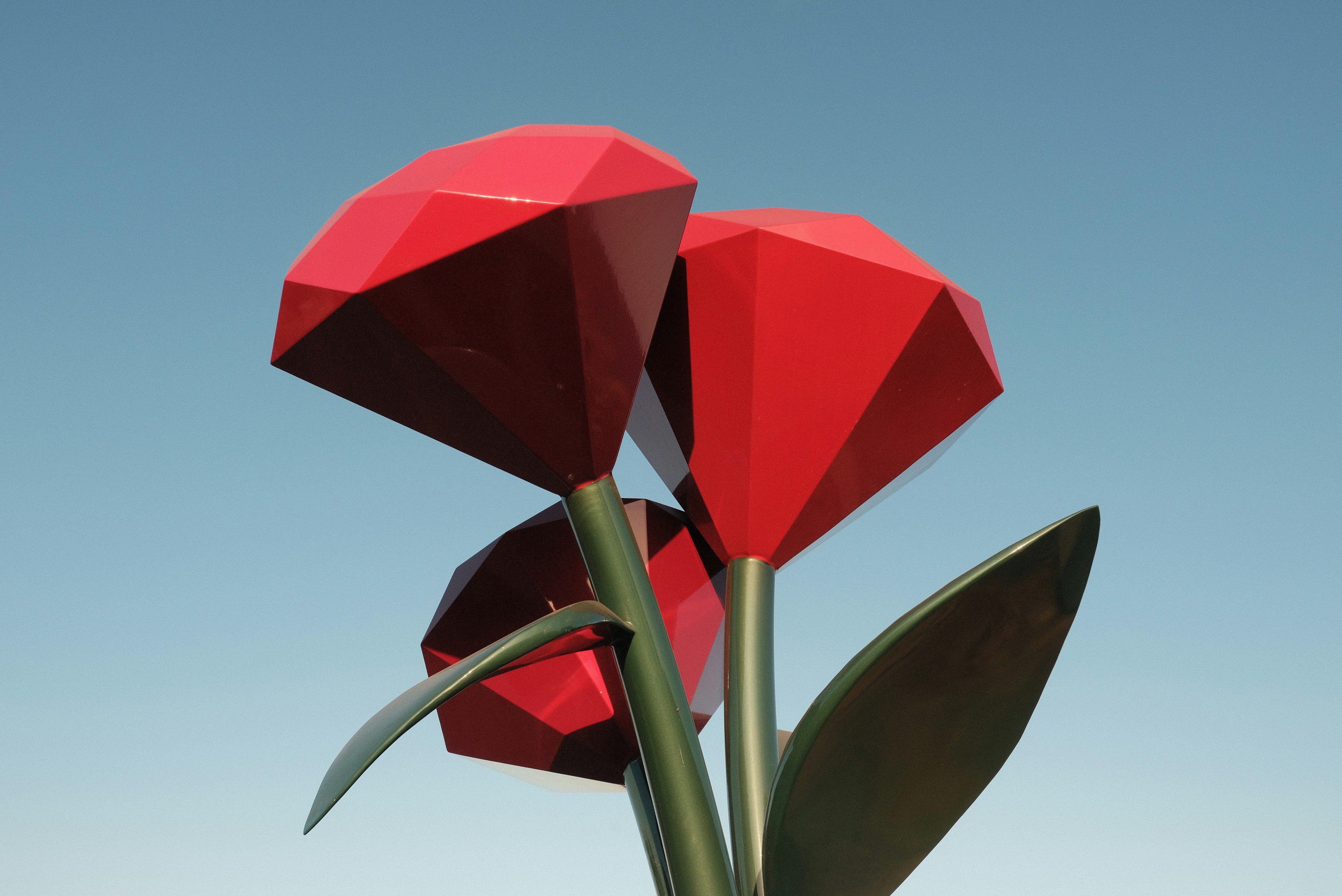 Crimson Facets Reaching the Sky: A Geometric Tulip Sculpture