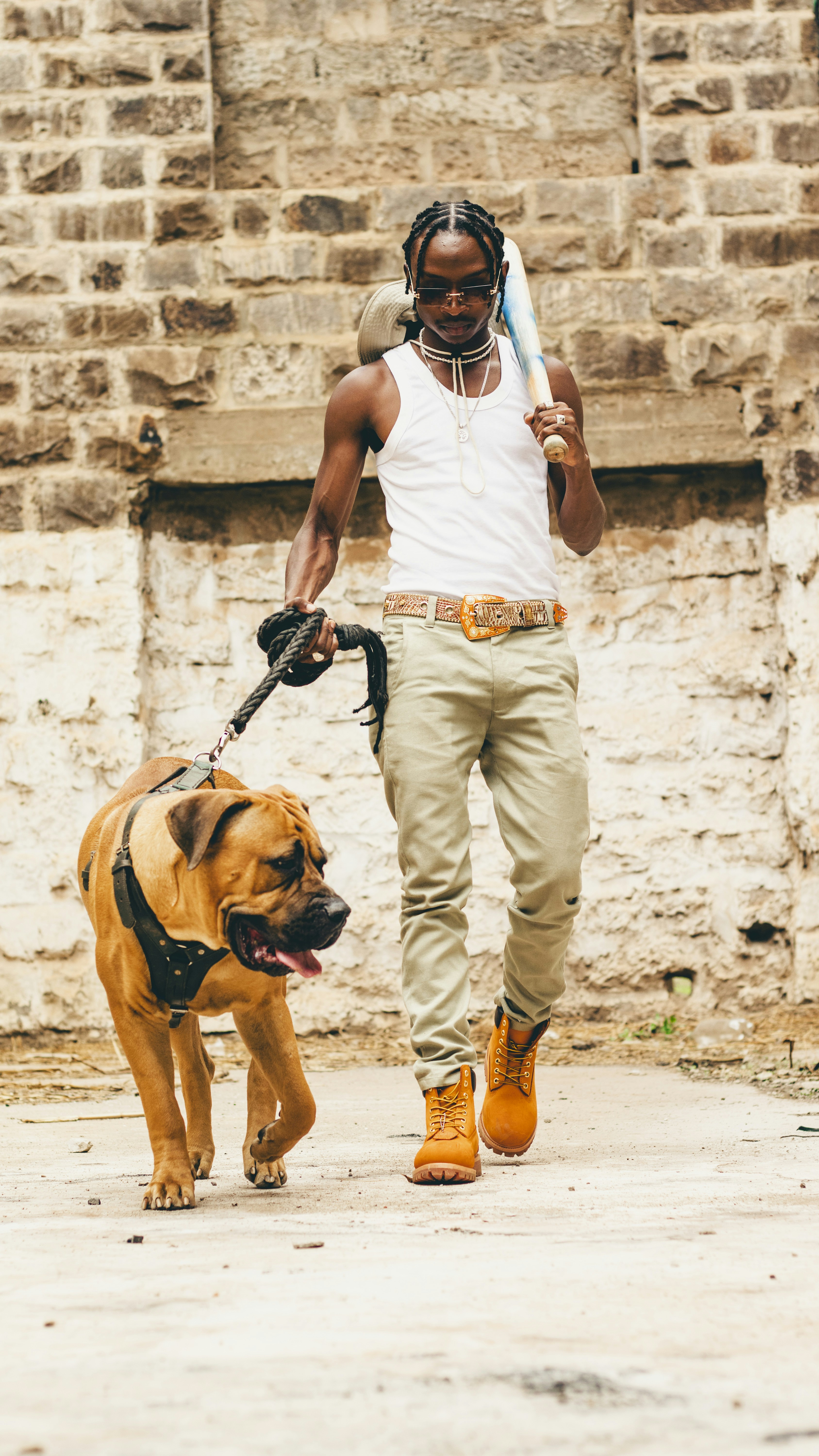 A man walking a dog on a leash