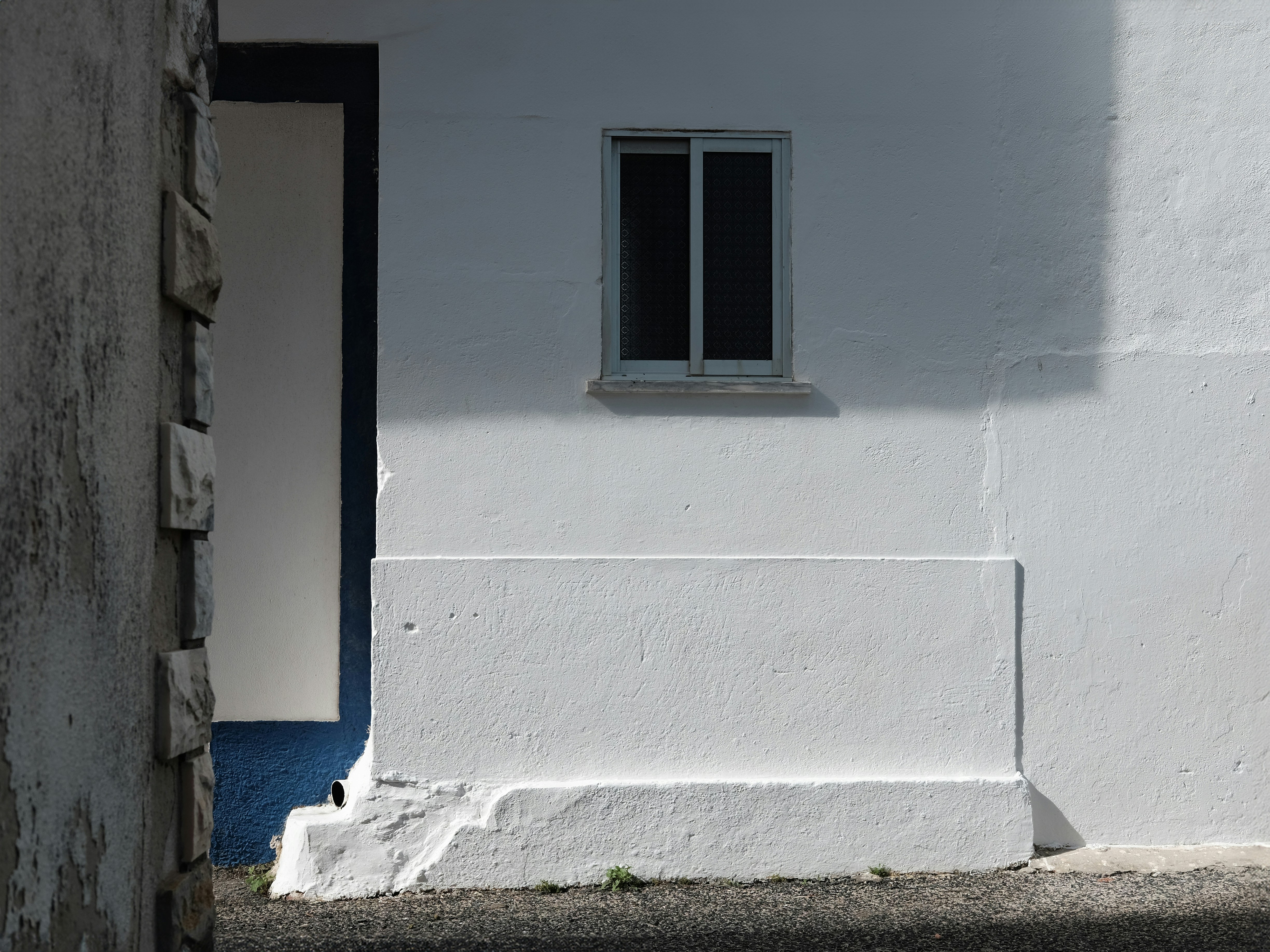 A white building with a blue door and window photo – Free Peniche Image ...