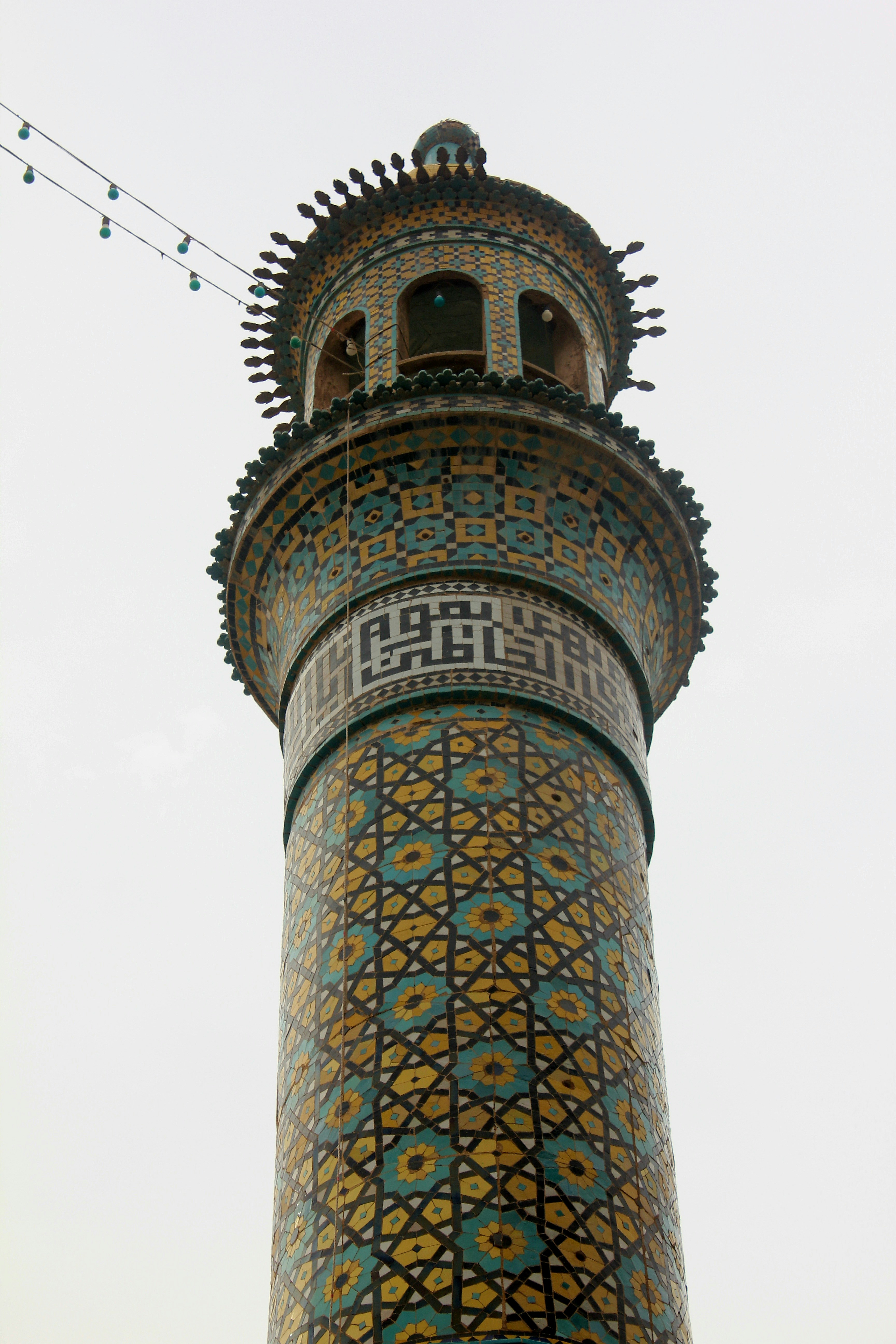 The Turquoise Crown: A Geometric Minaret Tower Reaching Toward the Sky