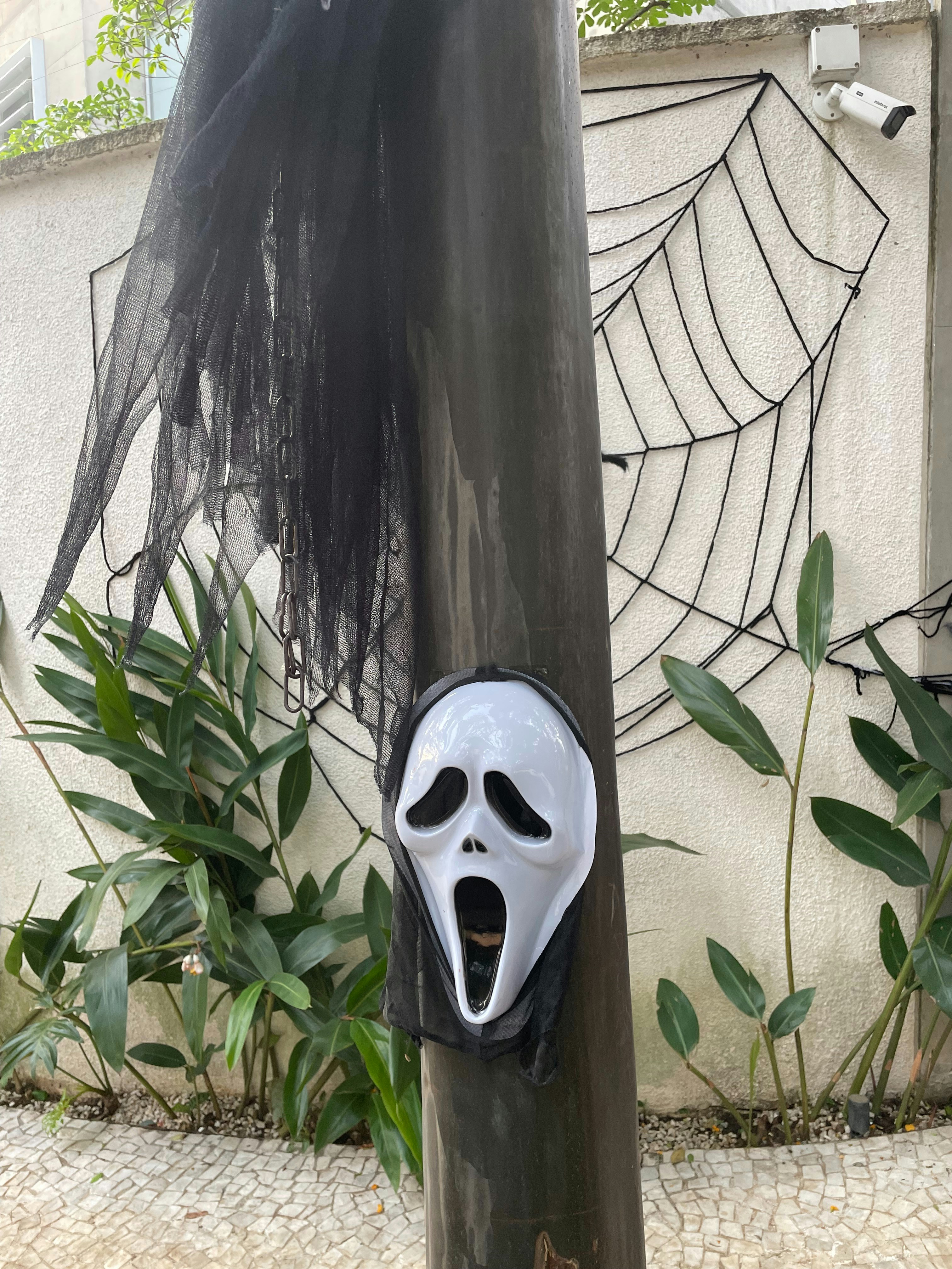 Ghostly Mask on a Midnight Post