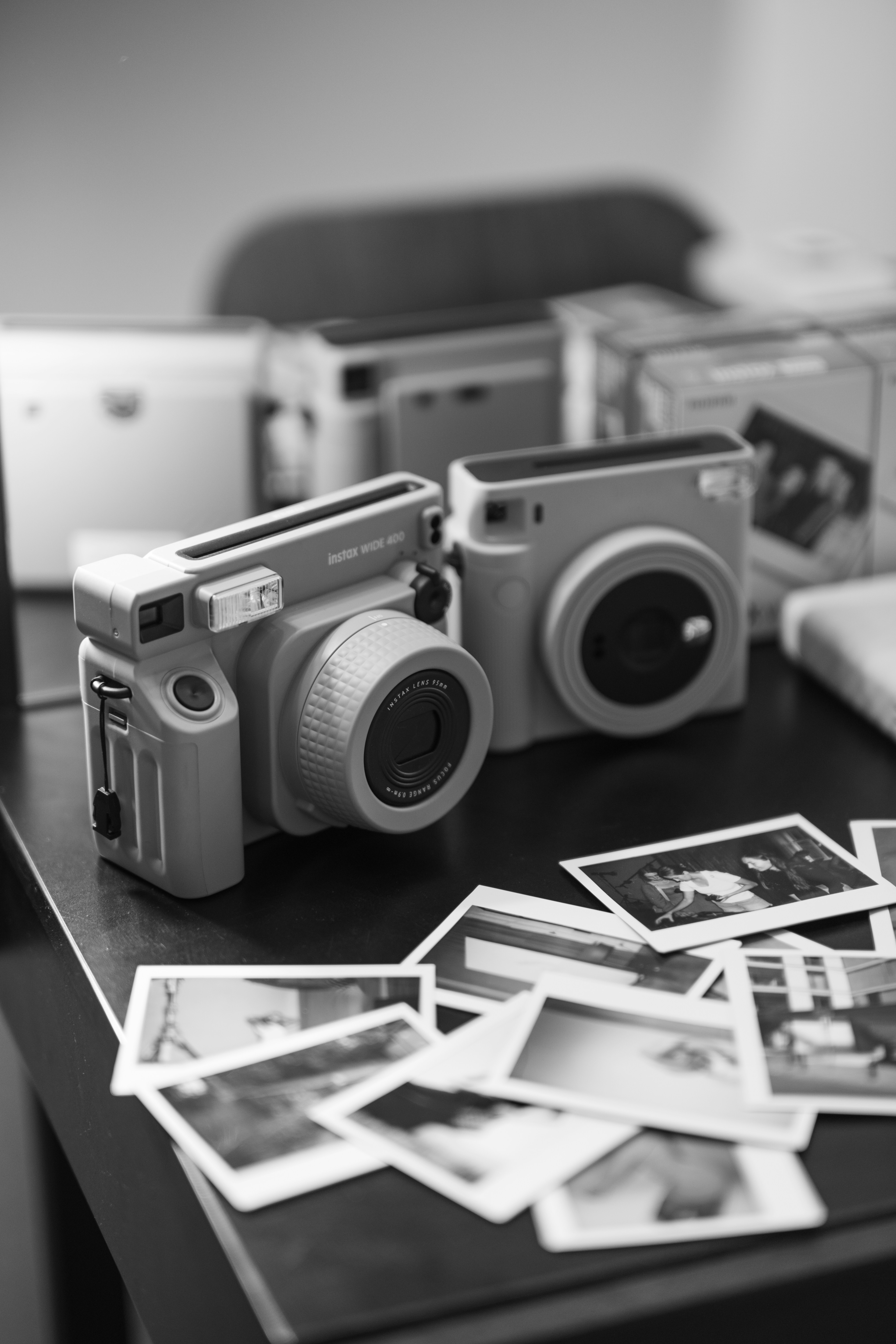 Analog Desk: Twin Fujifilm Cameras Guard a Cascade of Printed Memories